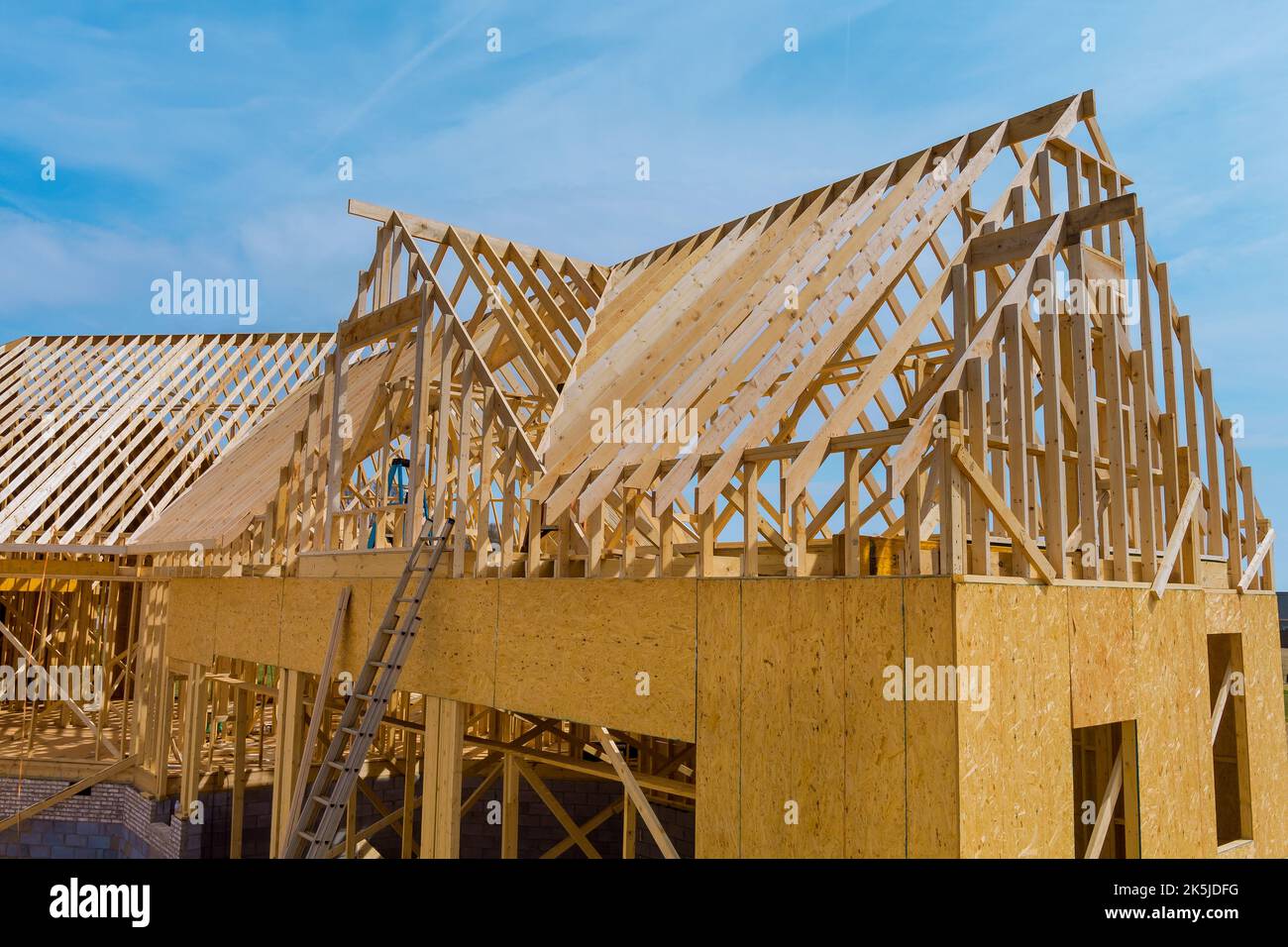 New residential under construction beams framing structure home wooden ...