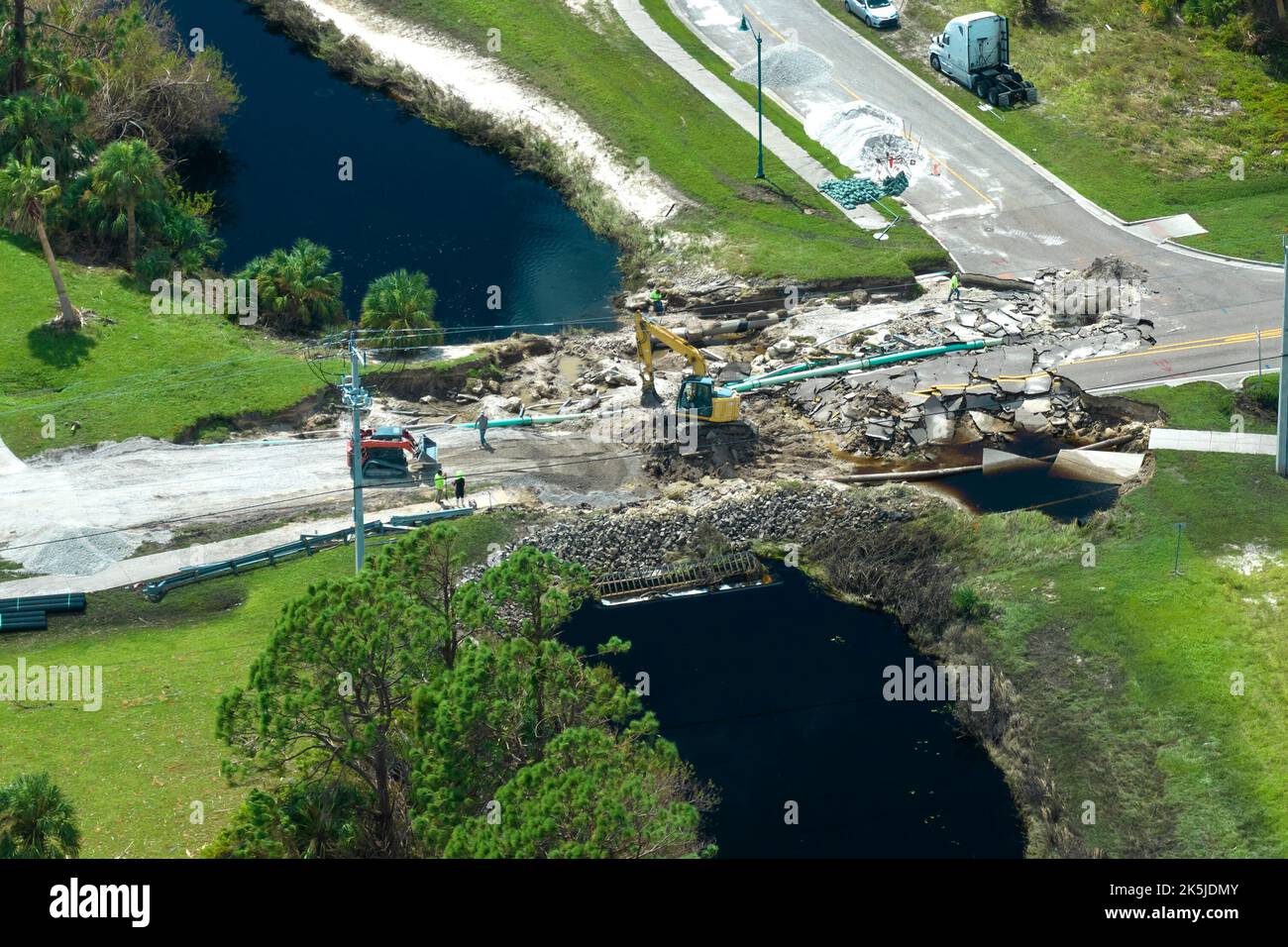 Aerial view of reconstruction of damaged road bridge destroyed by river ...