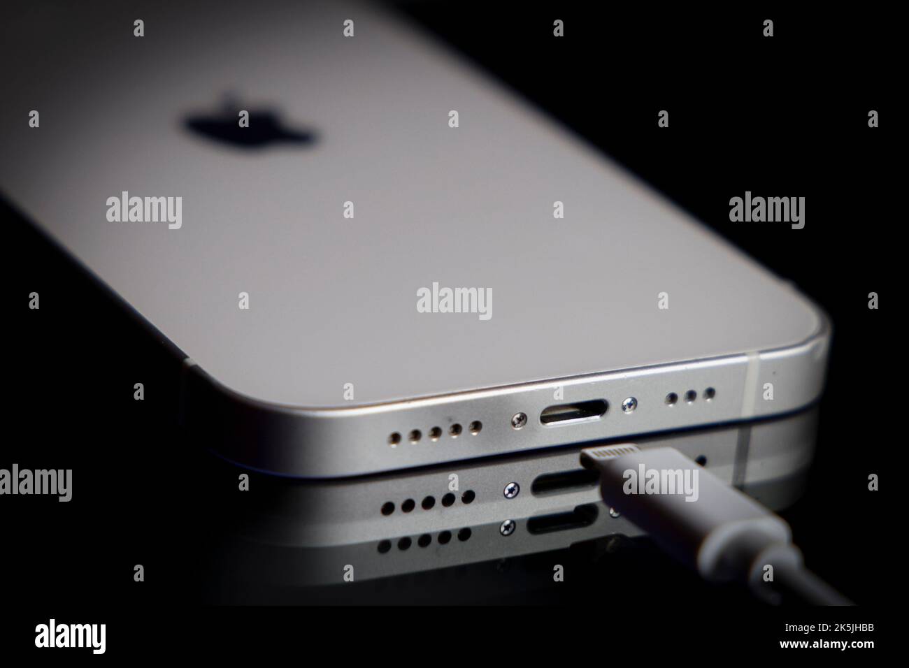 A Apple Lightning port charging cable is seen with with an iPhone in this illustration photo in ...