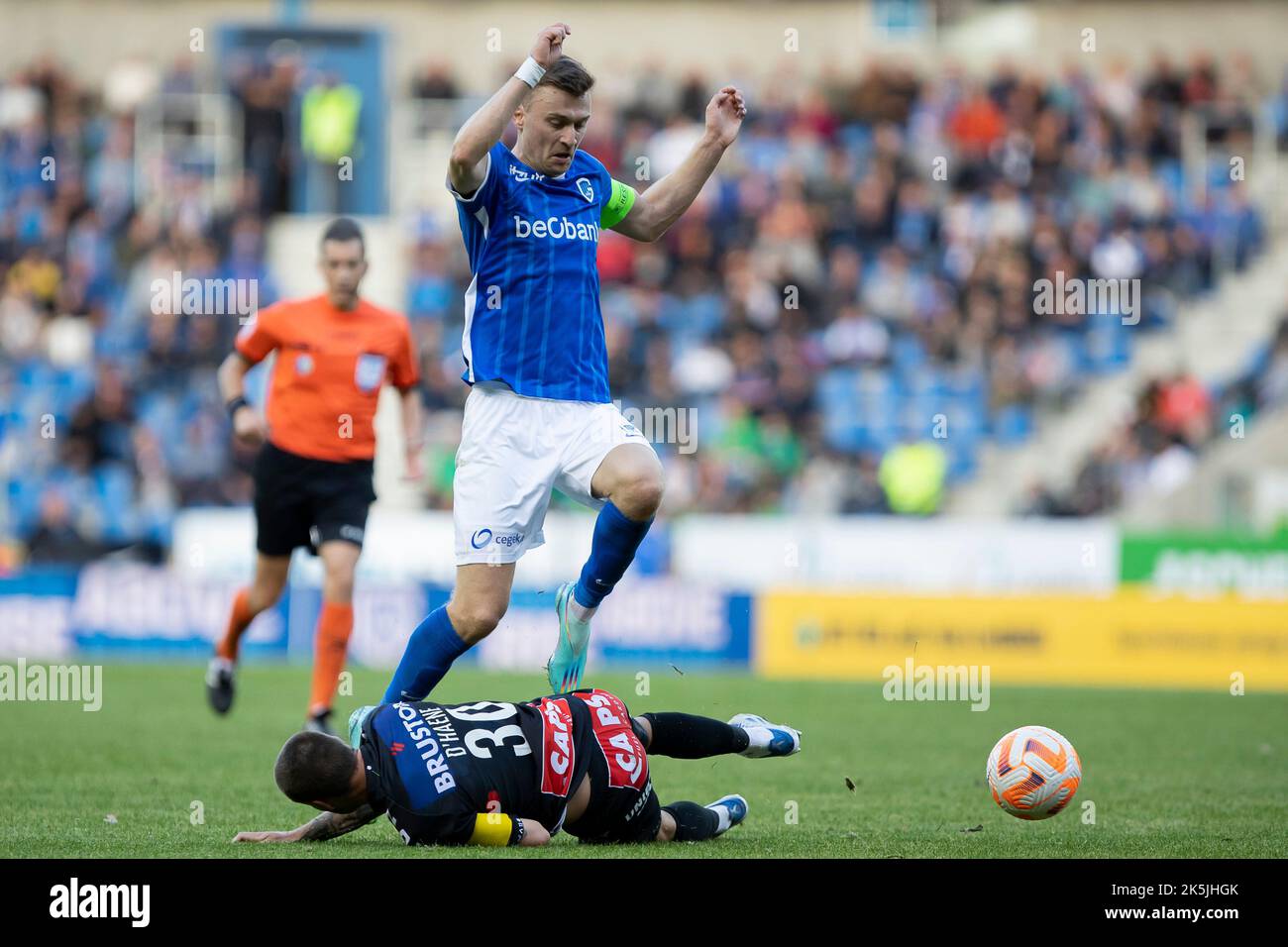 Kortrijk's Kristof D'Haene and Genk's Bryan Heynen fight for the ball ...