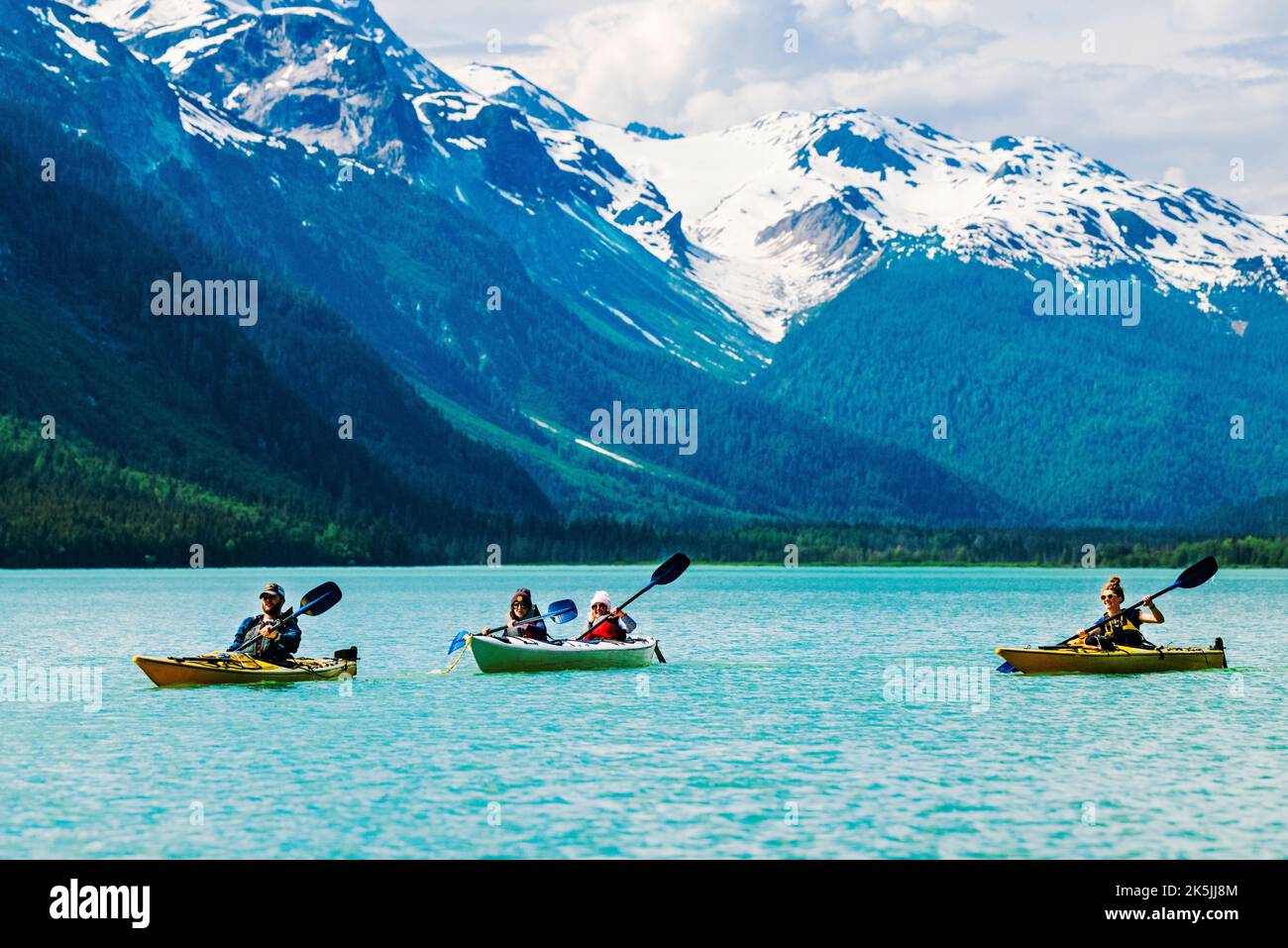Colorful kayakers; Chilkoot Lake; Chilkoot State Recreation Site; Coast ...
