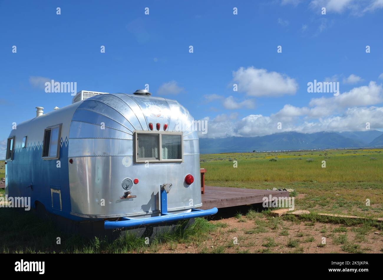 Vintage airstream trailer in scenic landscape Stock Photo - Alamy