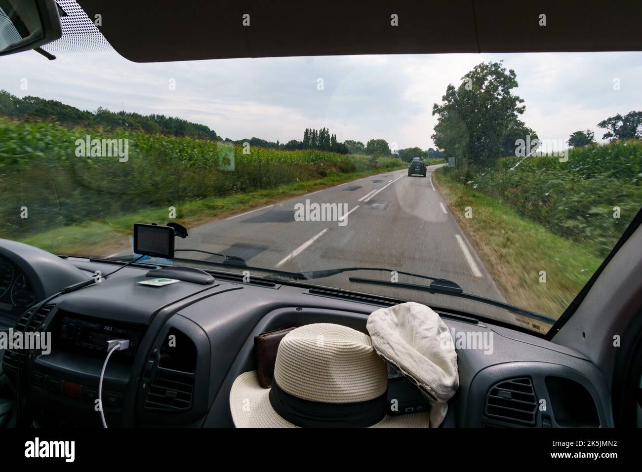 View from passenger seat out of a cockpit of an camper van with ...