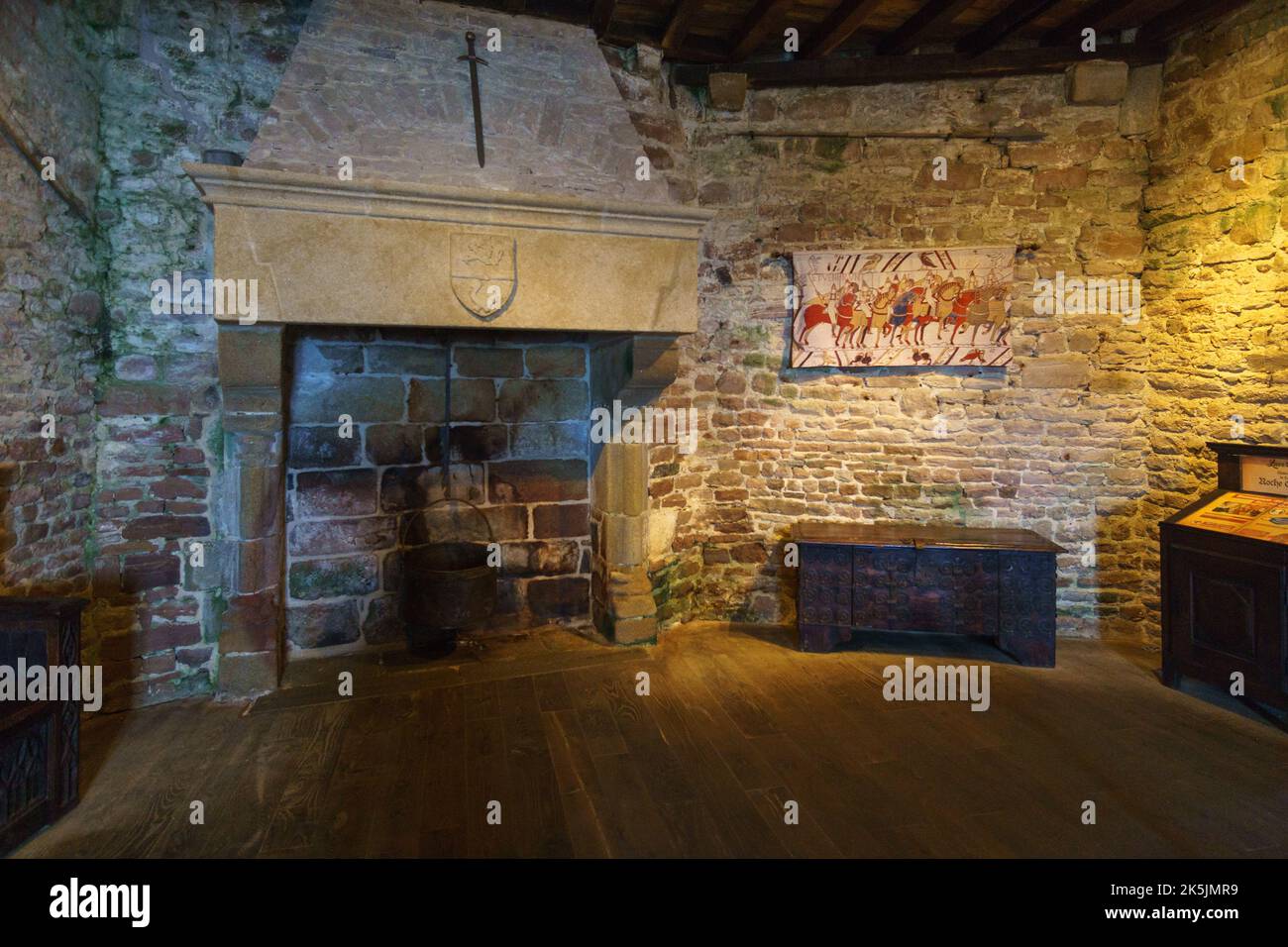 Medieval room inside a french castle with chimney, Fort la Latte ...