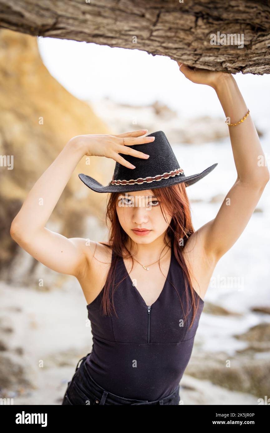 Young Woman in Black Cowboy Hat on a California Beach Stock Photo - Alamy