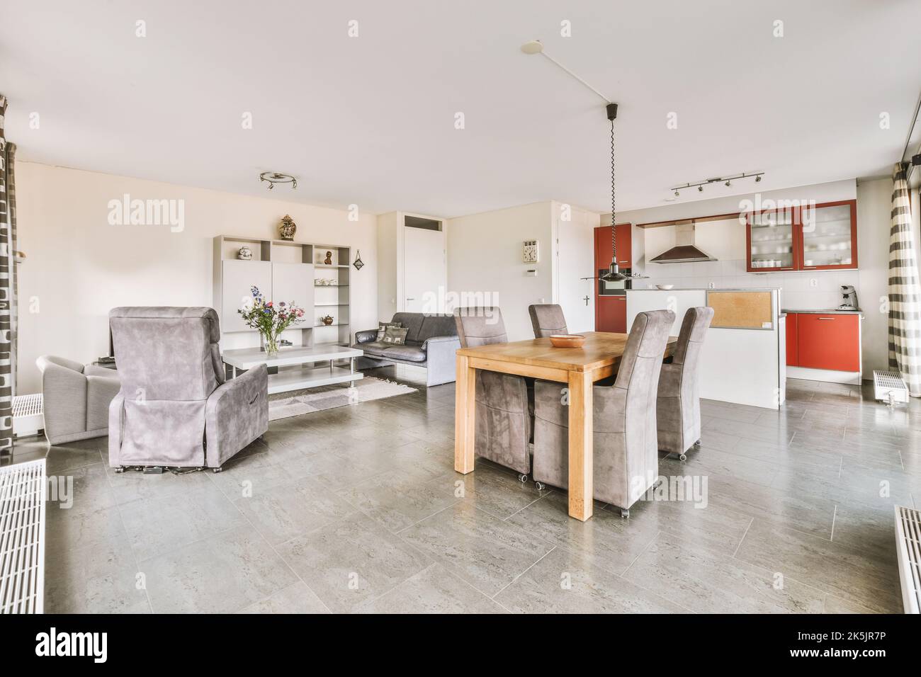 Counters with stove and oven located in modern kitchen near dining room ...