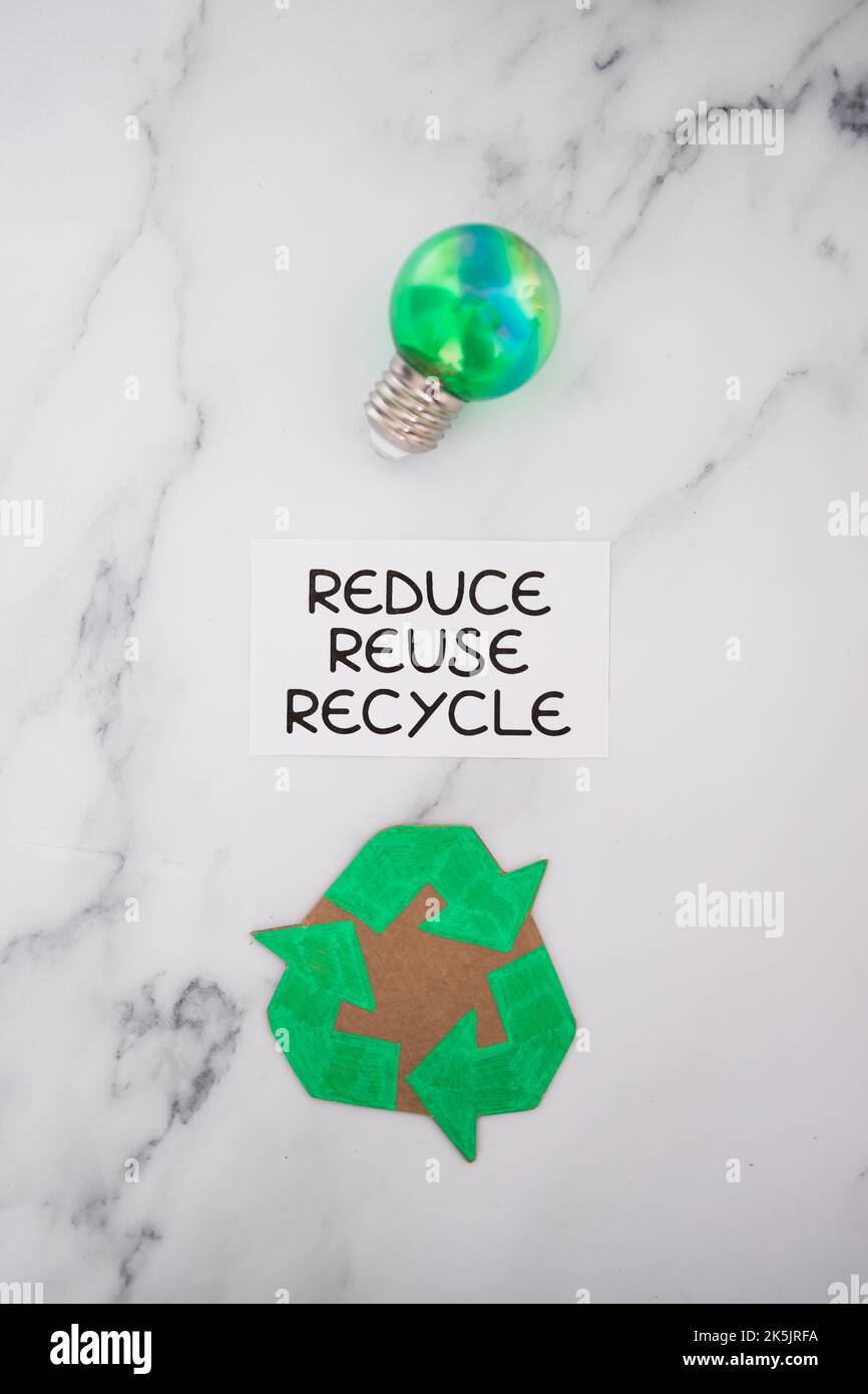 reduce reuse recycle sign with green light bulb and recycle icon ...