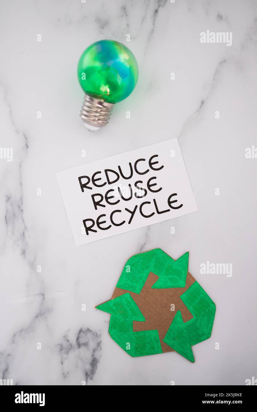 reduce reuse recycle sign with green light bulb and recycle icon ...