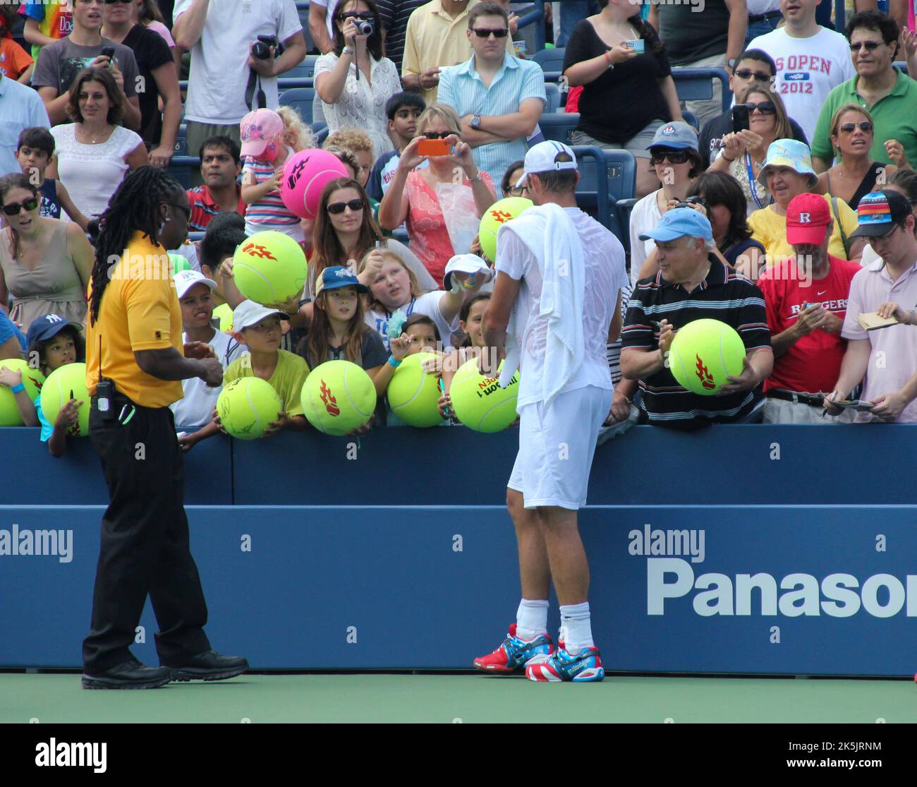 Grand Slam Champion Andy Roddick Of The United States Signs Autographs After Practice For 2012