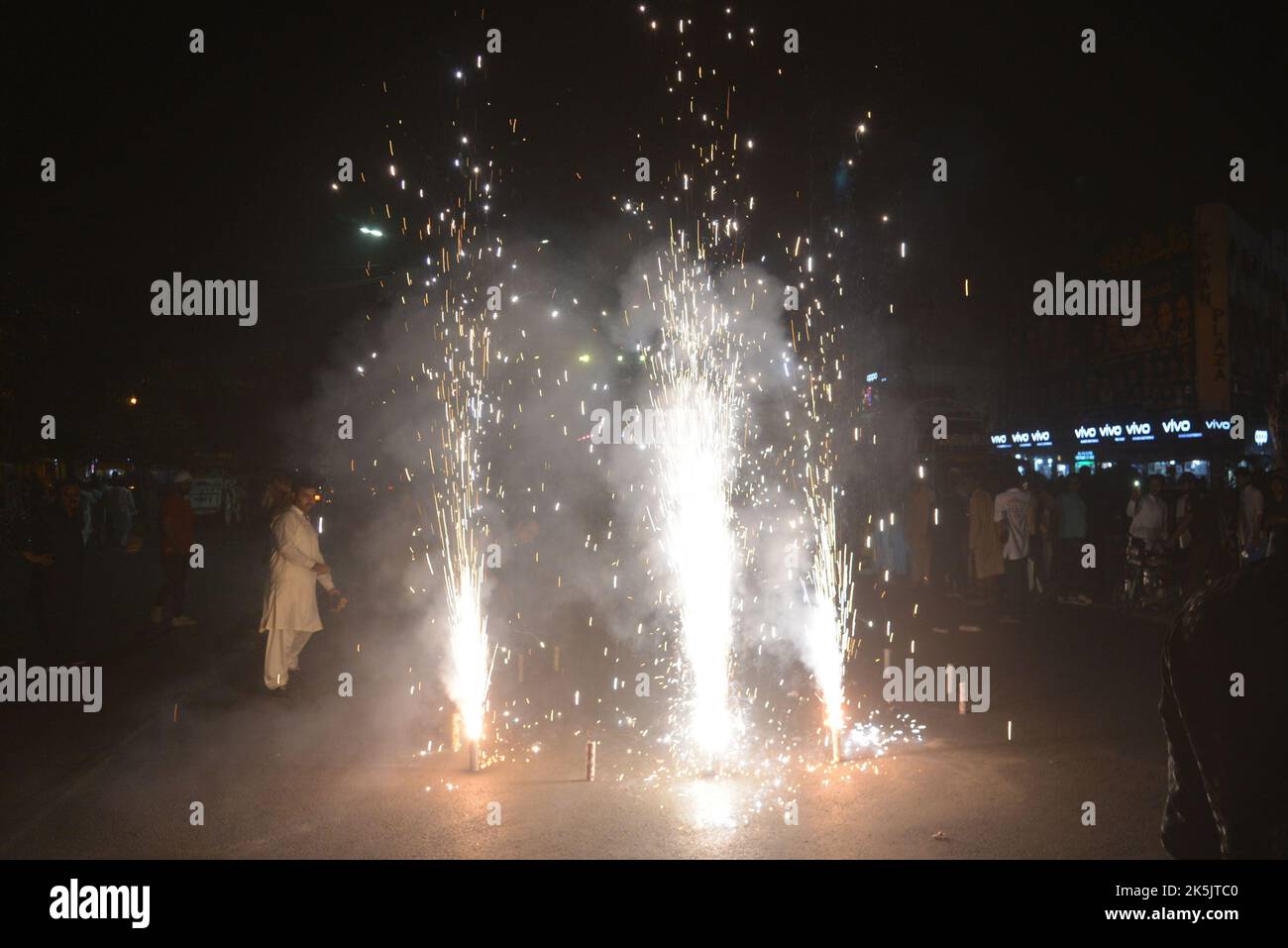 Pakistani people light fireworks on the eve of the Muslim festival of ...