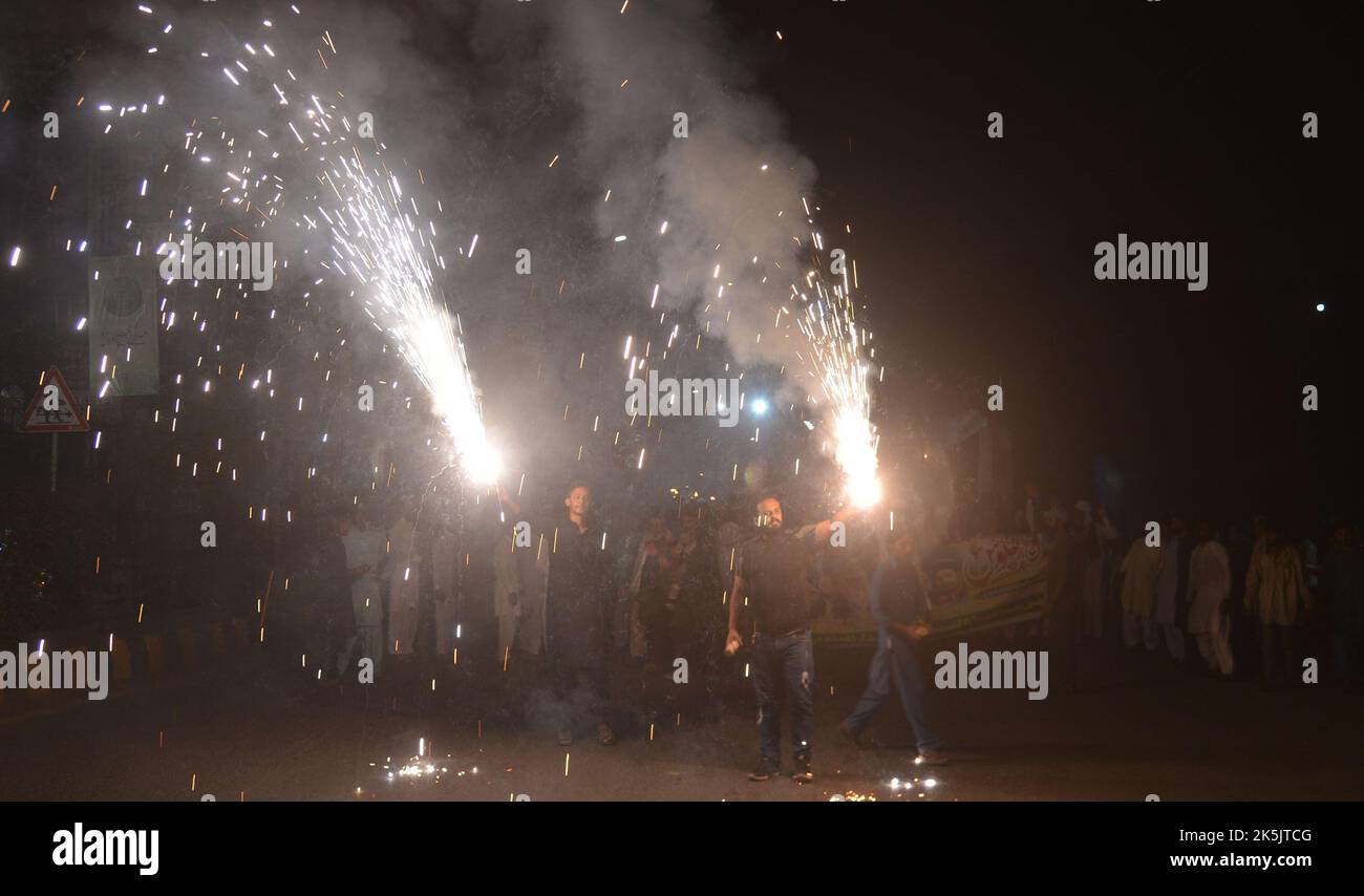 Pakistani people light fireworks on the eve of the Muslim festival of ...