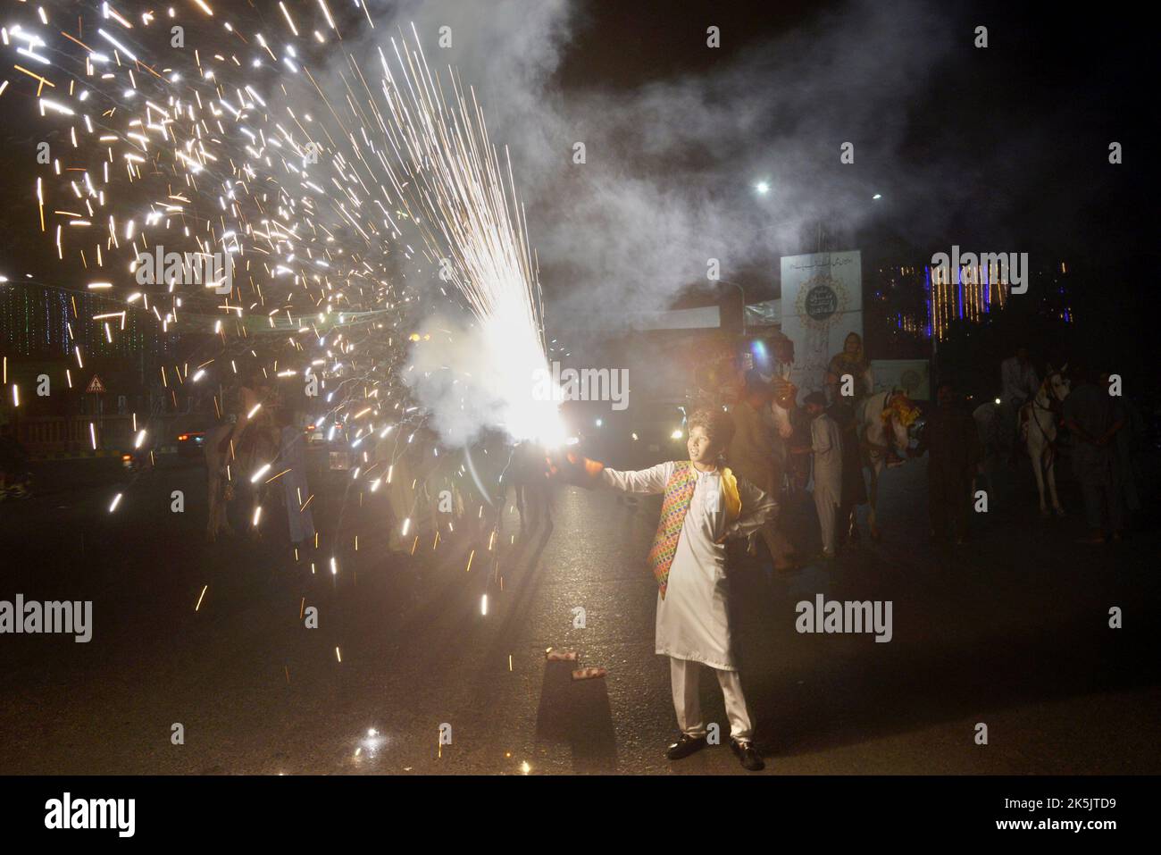 Pakistani people light fireworks on the eve of the Muslim festival of ...