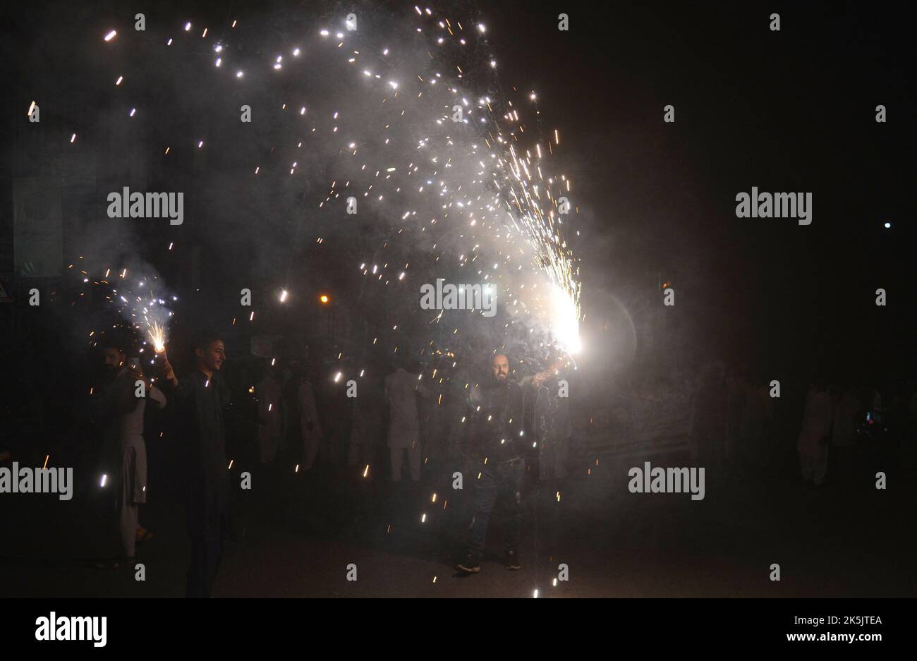 Pakistani people light fireworks on the eve of the Muslim festival of ...