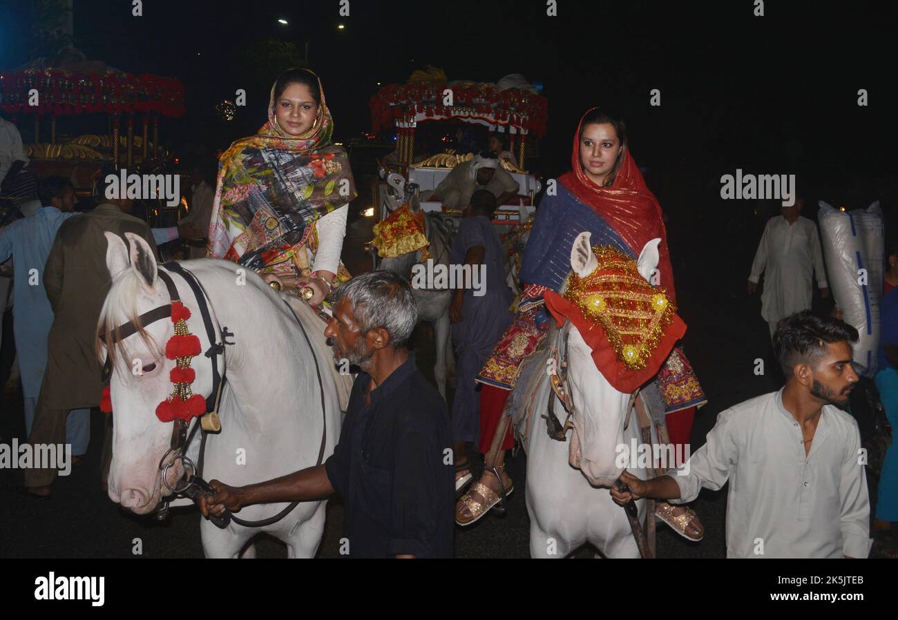 Pakistani people light fireworks on the eve of the Muslim festival of ...
