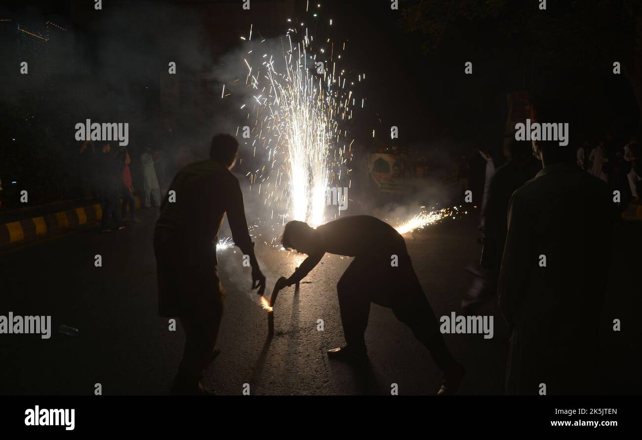 Pakistani people light fireworks on the eve of the Muslim festival of ...