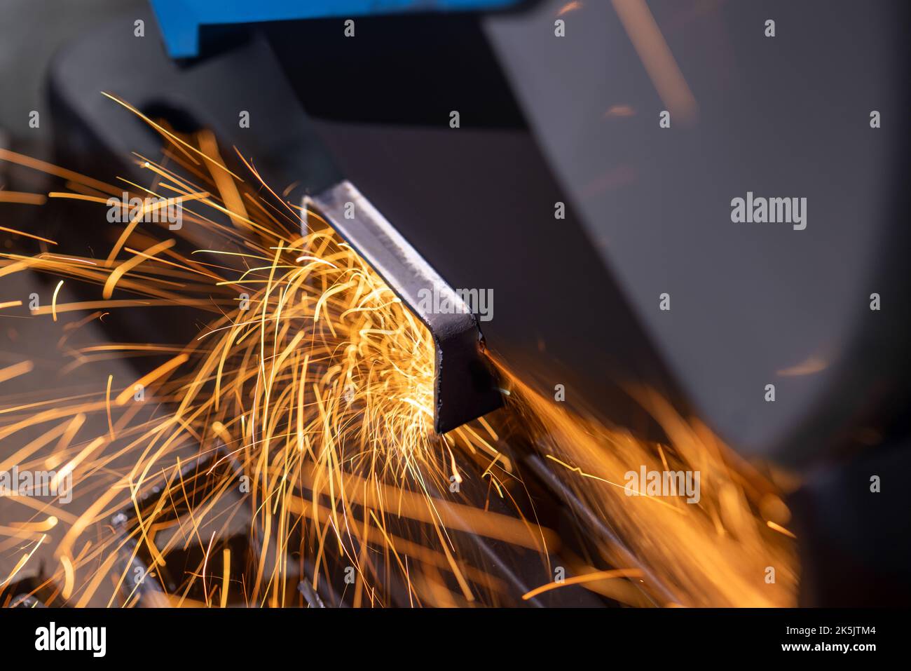 Worker cutting steel rectangular pipe in construction site Stock Photo ...