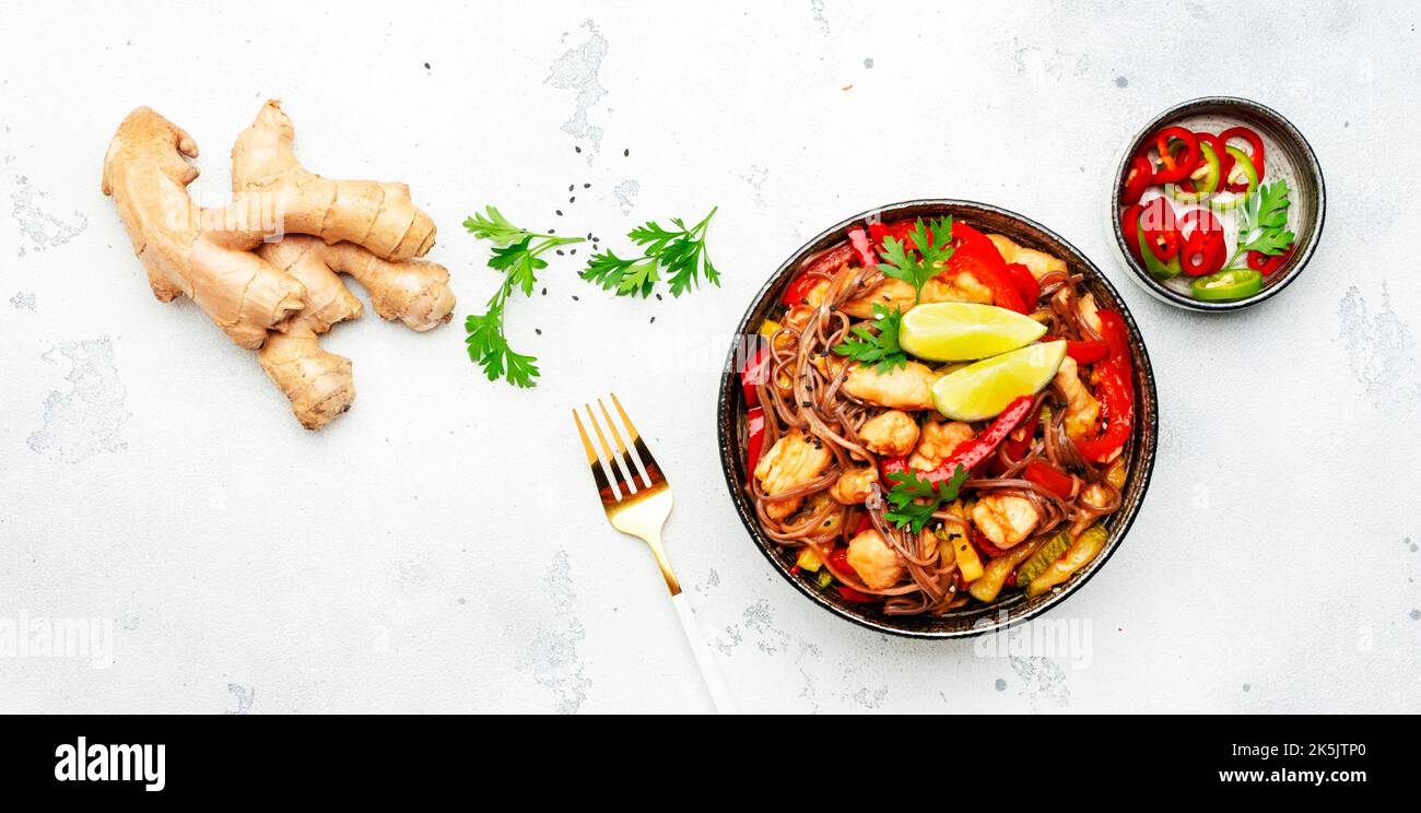 Asian cuisine, stir fry noodles with chicken and vegetables, paprika ...