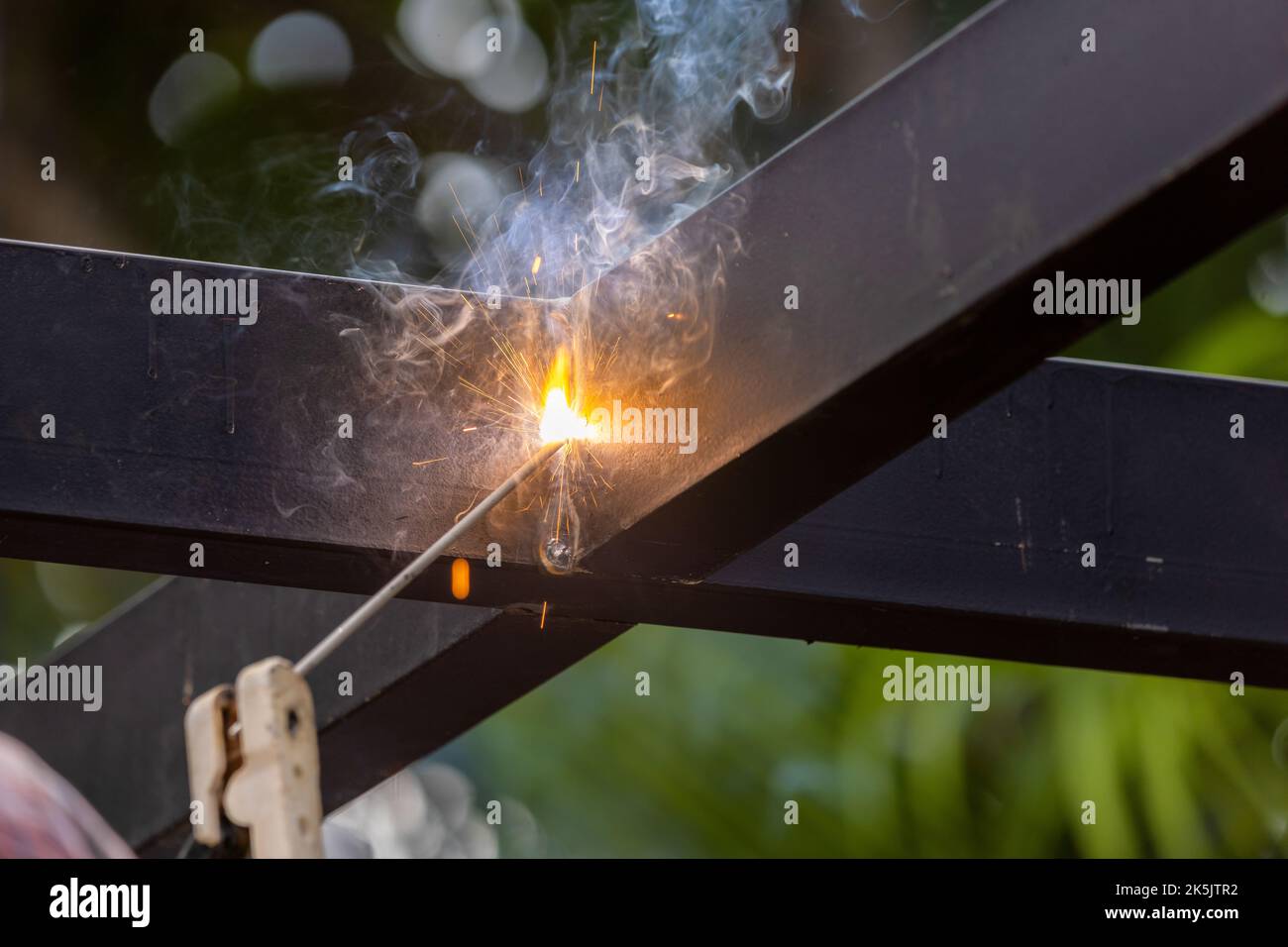 worker welding steel pipe in construction site Stock Photo - Alamy