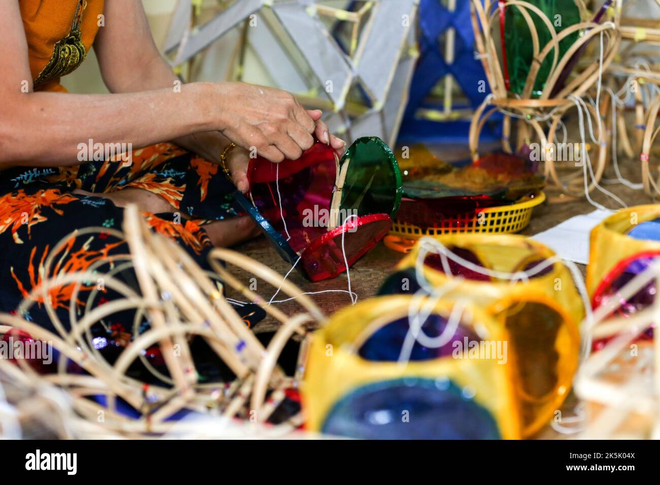 Yangon, Myanmar. 7th Oct, 2022. A woman makes a traditional lantern for ...