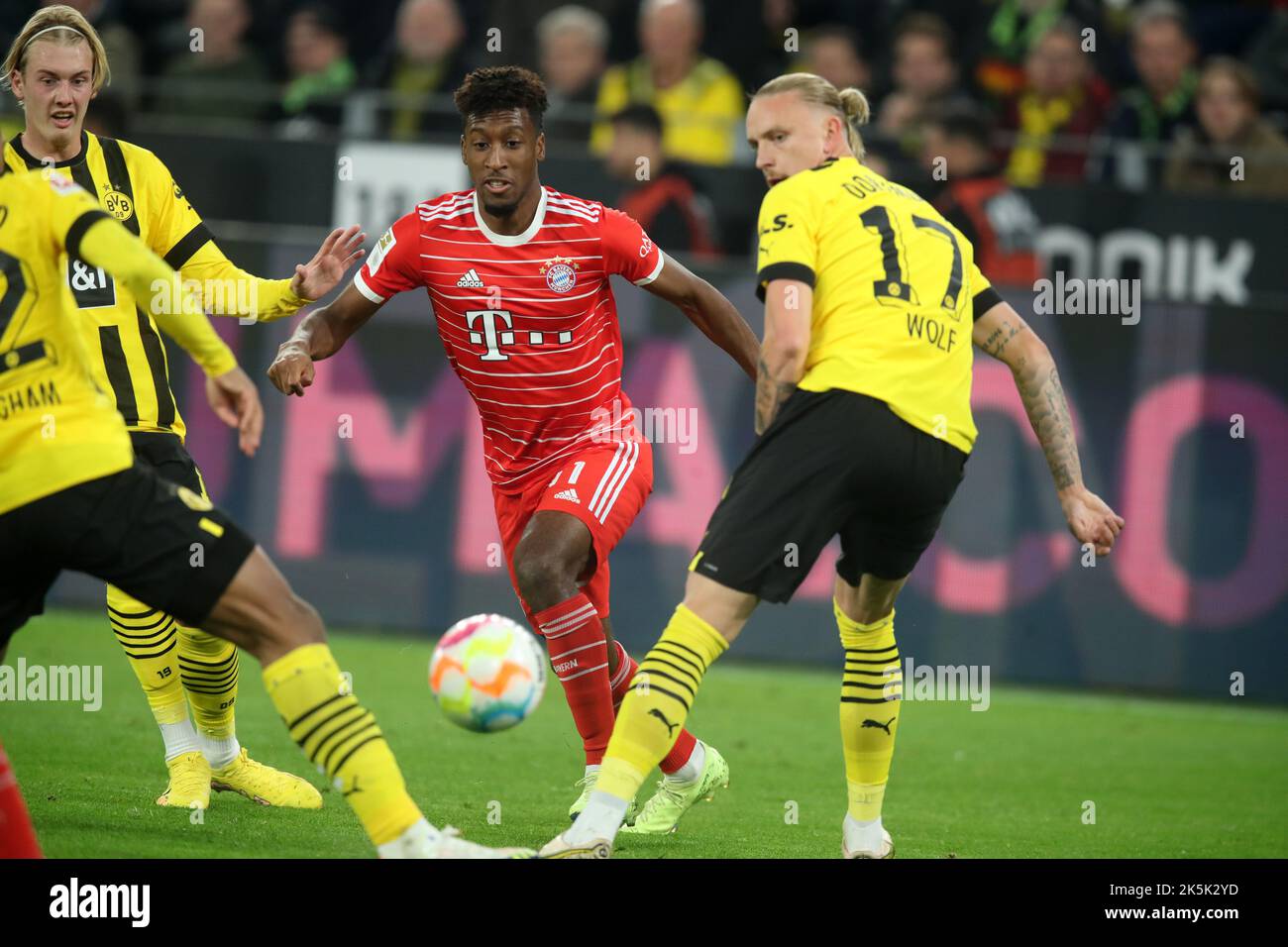 Kingsley Coman of Bayern Muenchen Marius Wolf of Borussia Dortmund ...