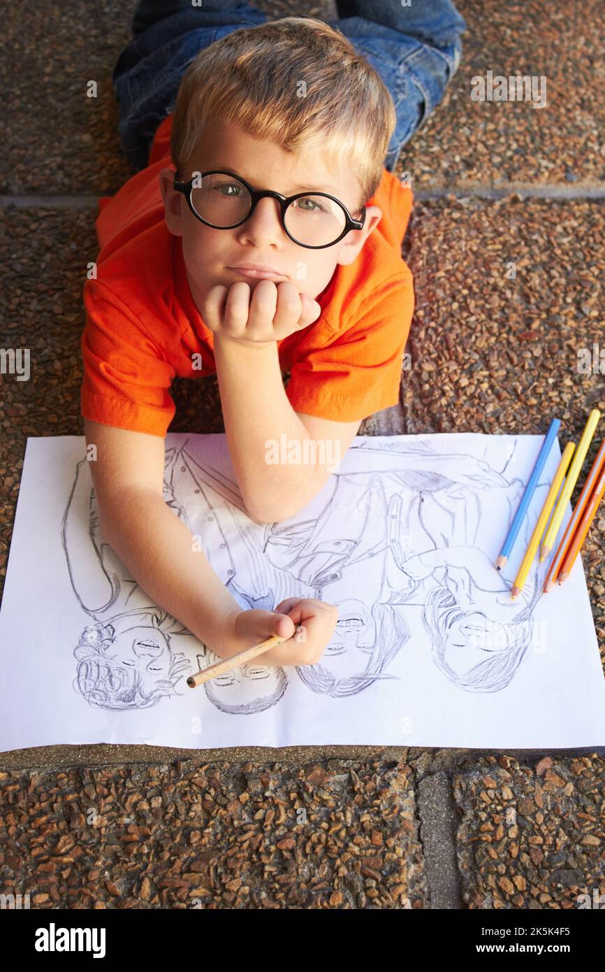 Adding the last few details. Talented little boy drawing an incredibly ...