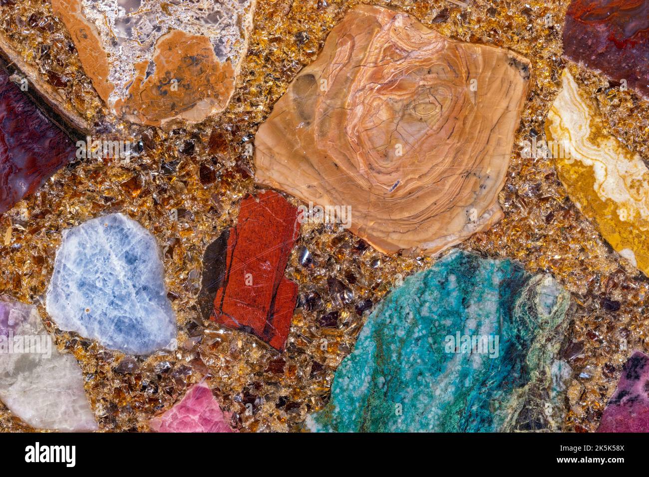 Detail of the polished agates embedded in a table top Stock Photo - Alamy