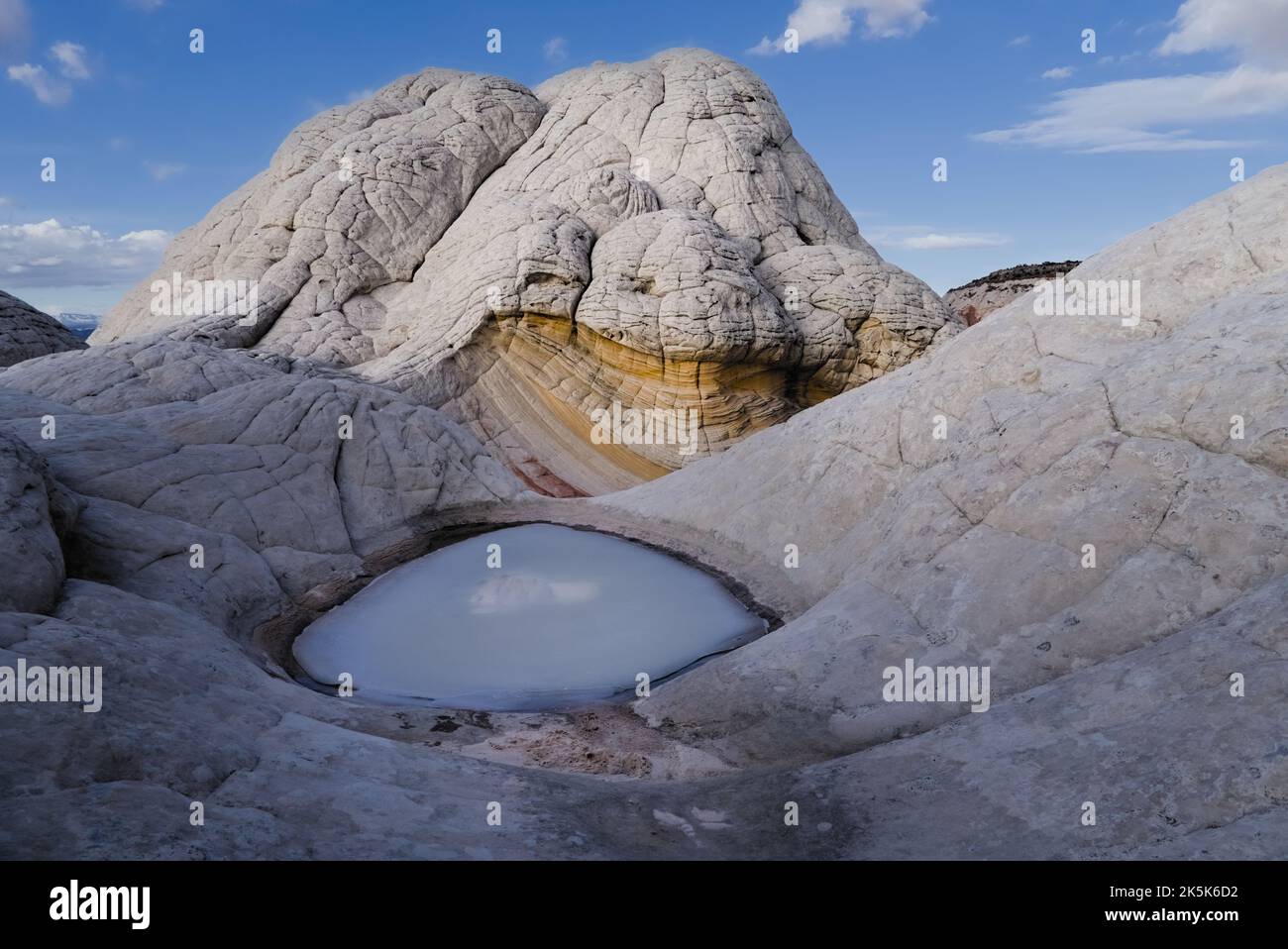 White sand stone formation surround a small ice pond in Wet Pocket ...