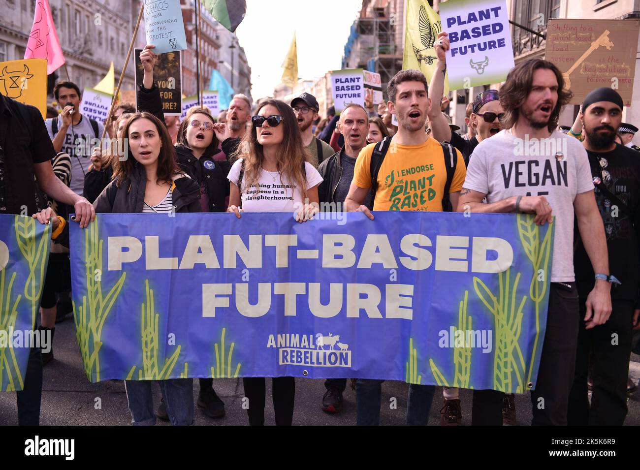 Protesters hold a banner during the demonstration. Animal Rebellion ...