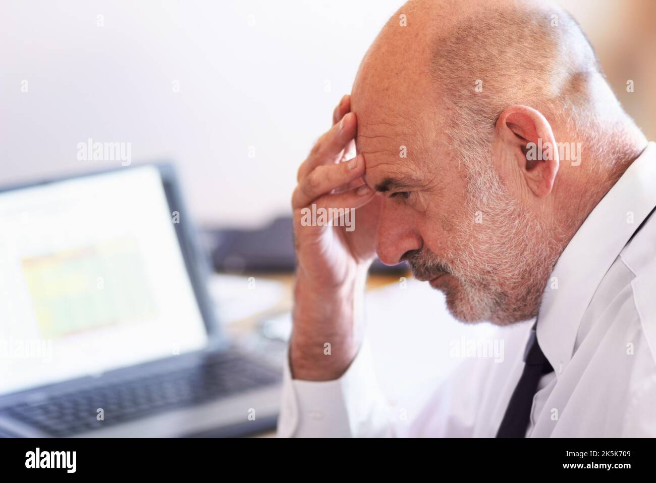 Being a stock trader is stressful. a mature businessman sitting with ... Being a stock trader is stressful. a mature businessman sitting with ...