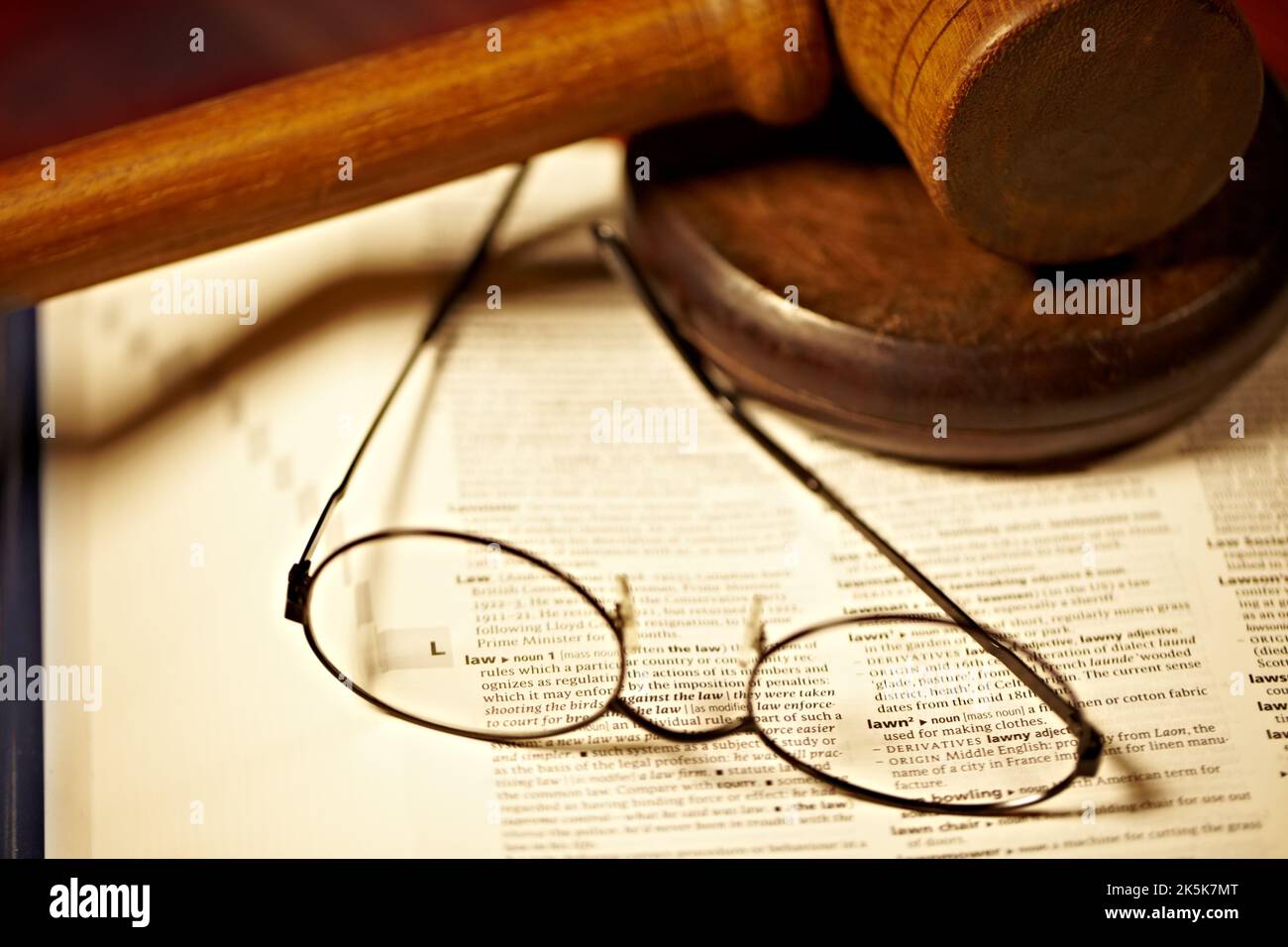 What is the law really. A dictionary open at the word law and a gavel ...