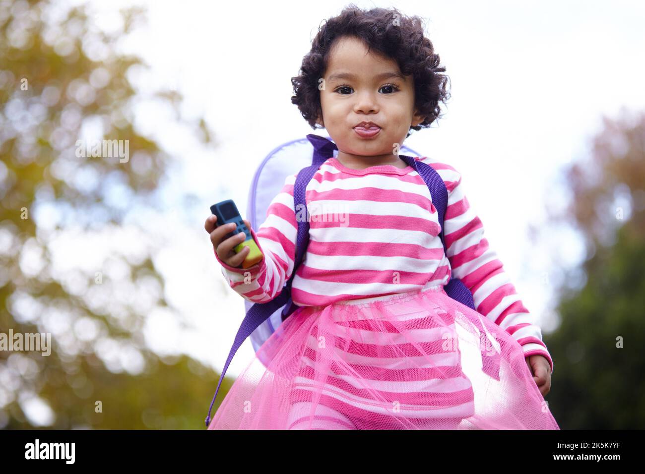 Another day, another adventure. an adorable little girl playing outside ...