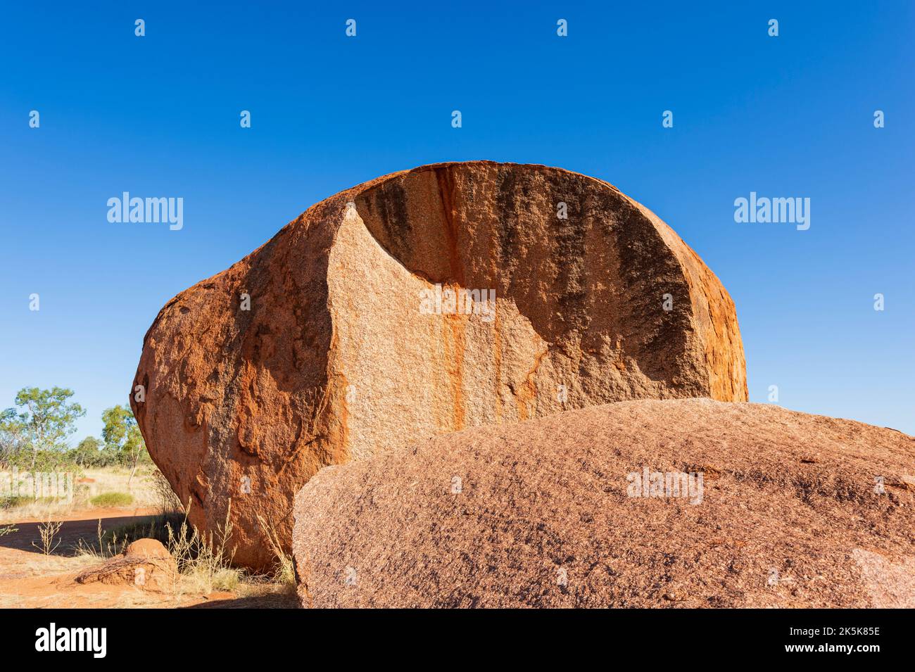 Split granite boulder at Devil's Marbles, a popular tourist destination ...