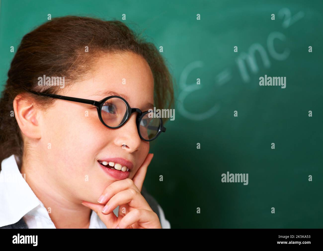 Finding the correct method. A cute brunette girl looking pensive in ...