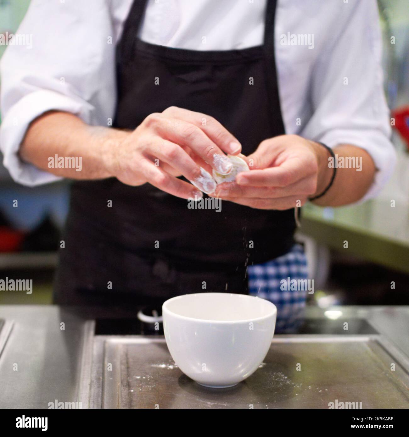 Hes an artist in the kitchen. A chef carefully preparing a gourmet meal ...