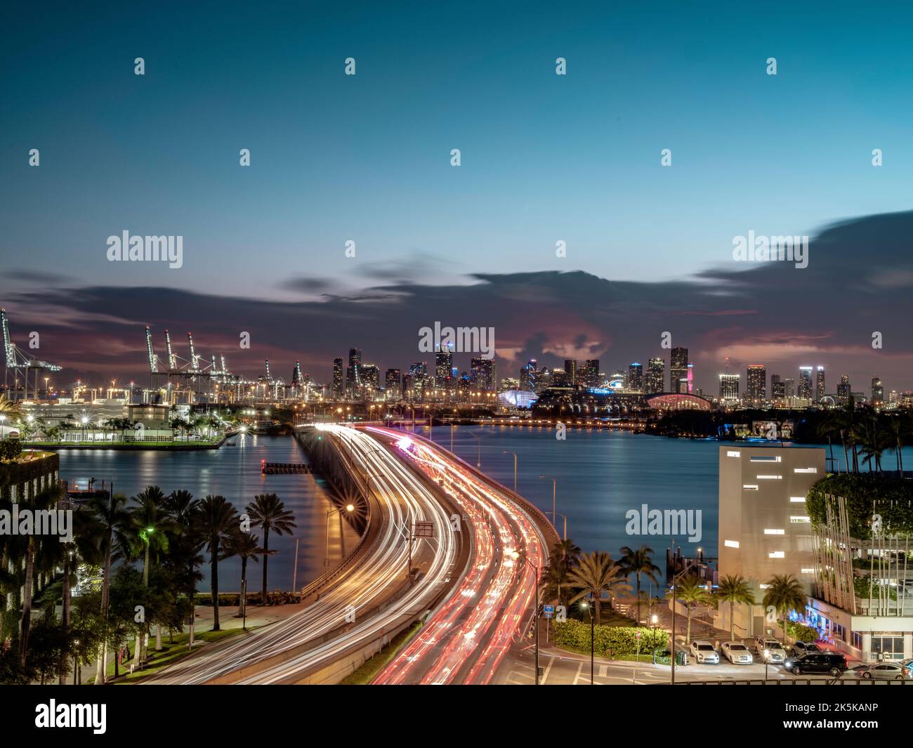 The light trails of cars on MacArthur Causeway bridge at night Stock ...