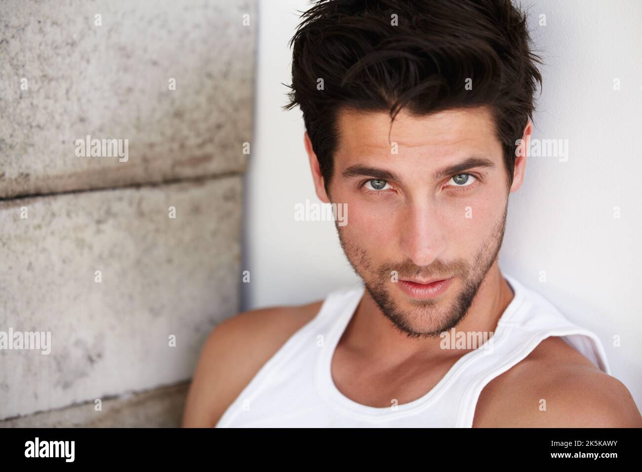 Giving you the look. Portrait of a good-looking young man staring up at ...