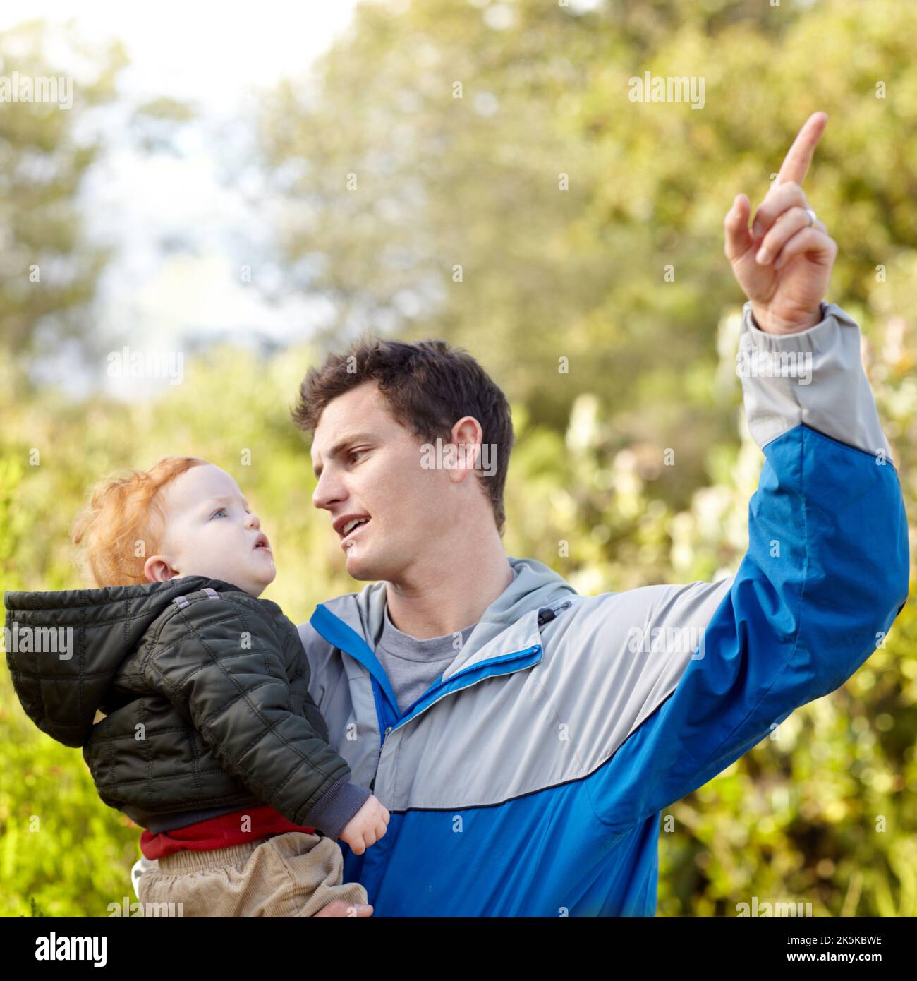 Passing the love of nature to the next generation. A young father ...