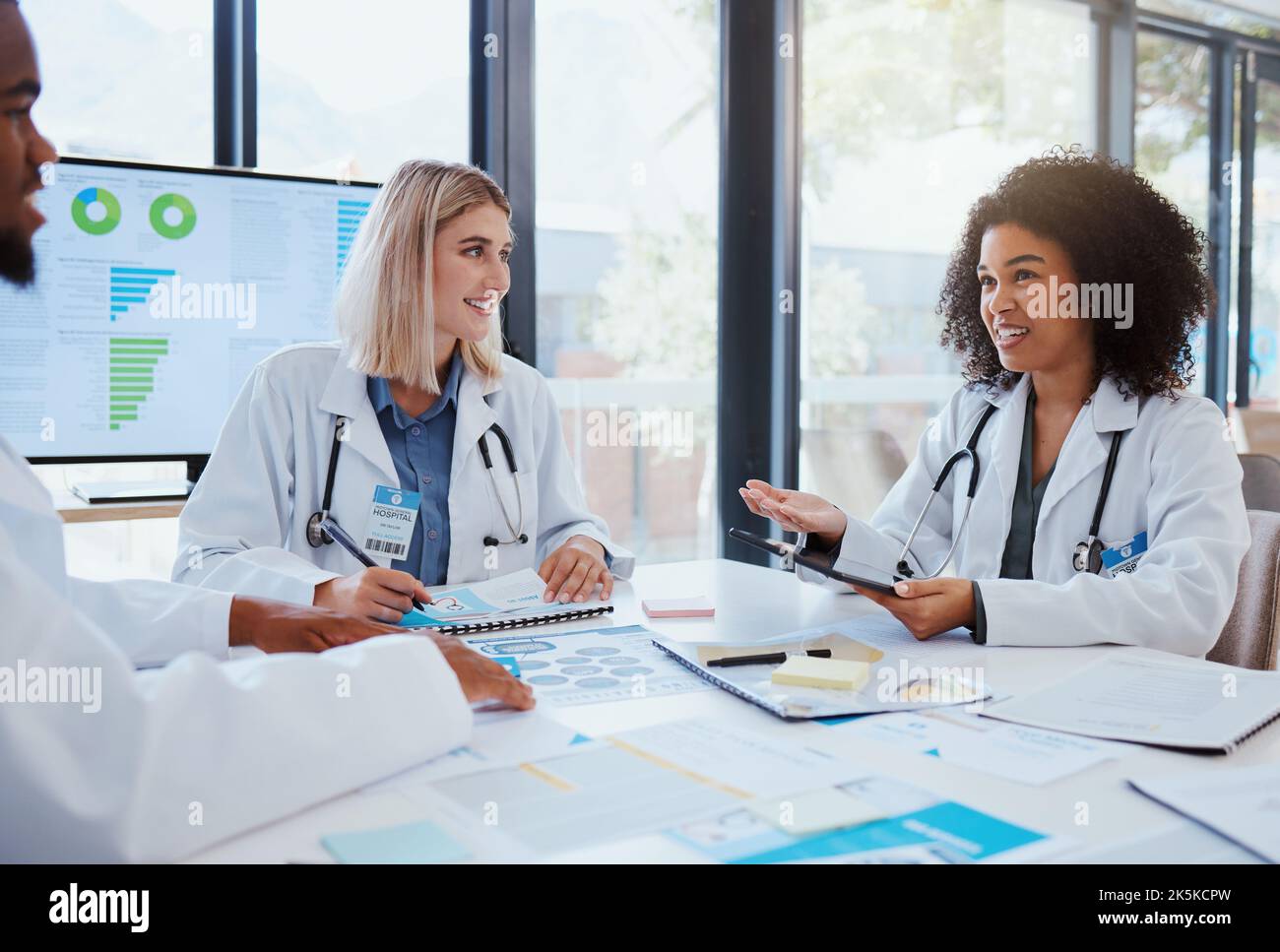 Healthcare, meeting and teamwork with a doctor and her team planning for growth, research and ...