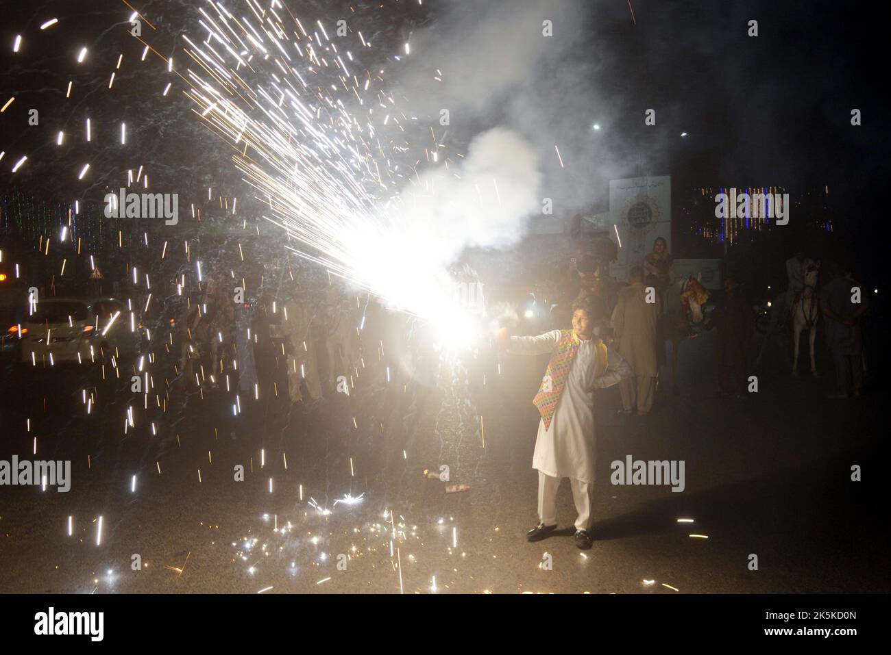 Lahore, Punjab, Pakistan. 8th Oct, 2022. Pakistani people light ...