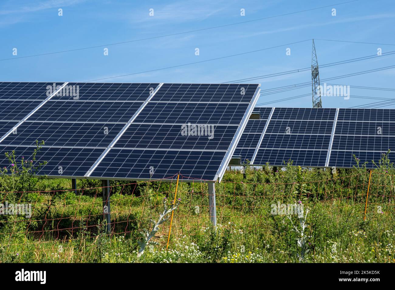 Solar power panels with power lines in the back seen in Germany Stock ...
