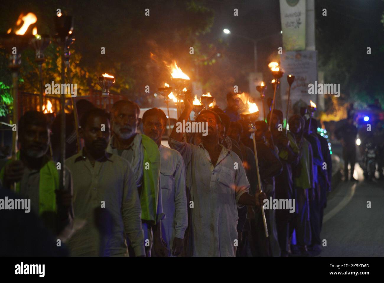 Lahore, Punjab, Pakistan. 8th Oct, 2022. Pakistani people light ...