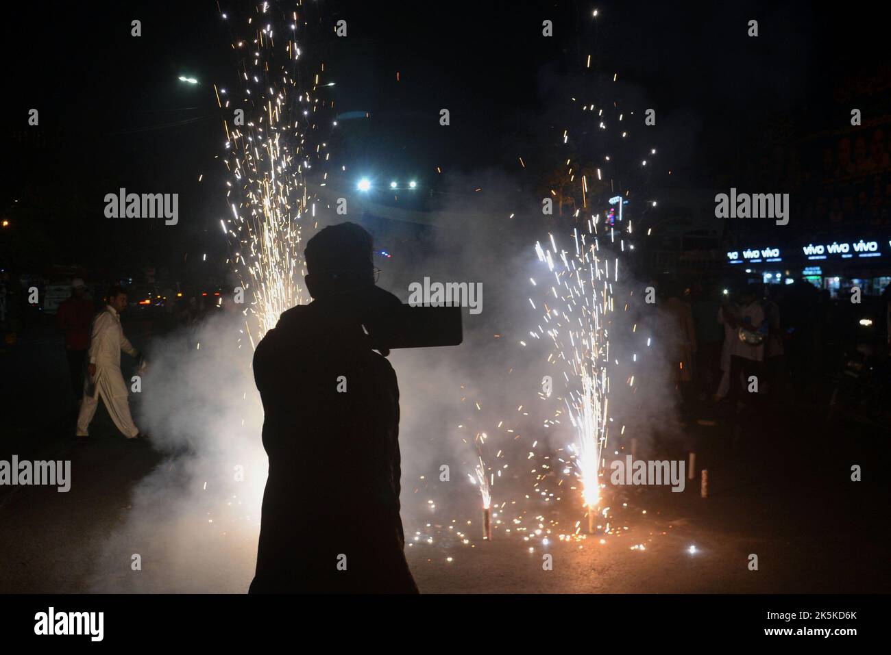 Lahore, Punjab, Pakistan. 8th Oct, 2022. Pakistani people light ...