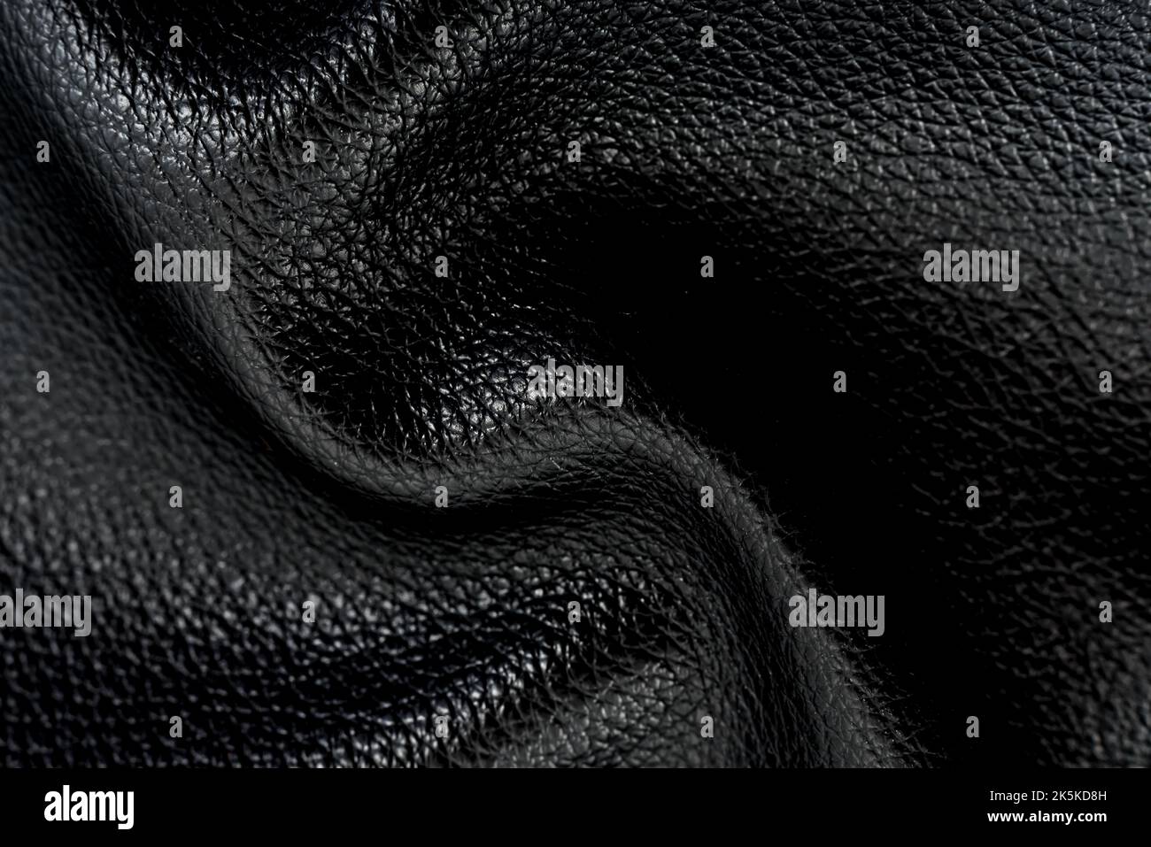 Black leather texture. Abstract background of dark leather with small ...