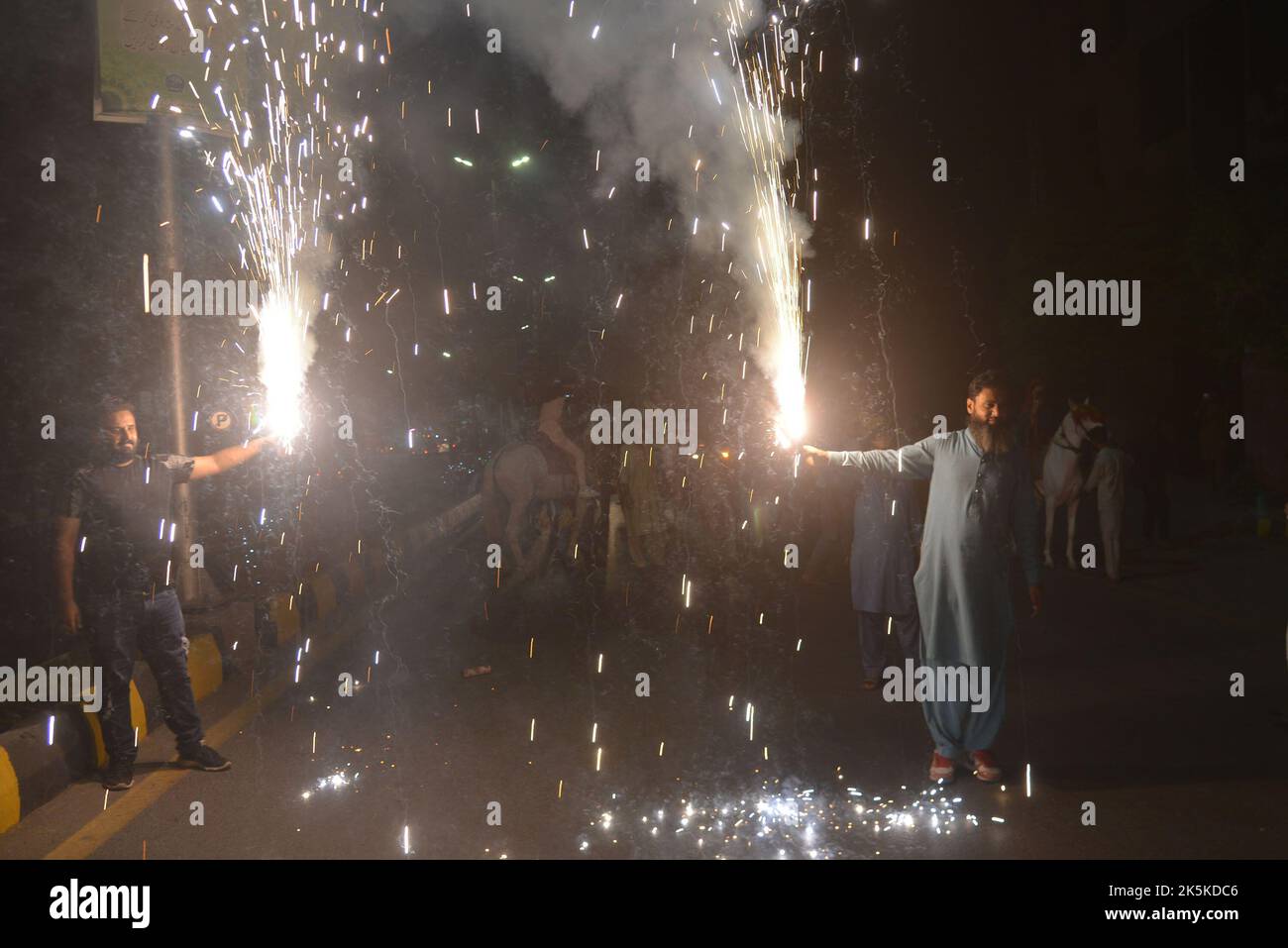 Lahore, Punjab, Pakistan. 8th Oct, 2022. Pakistani people light ...