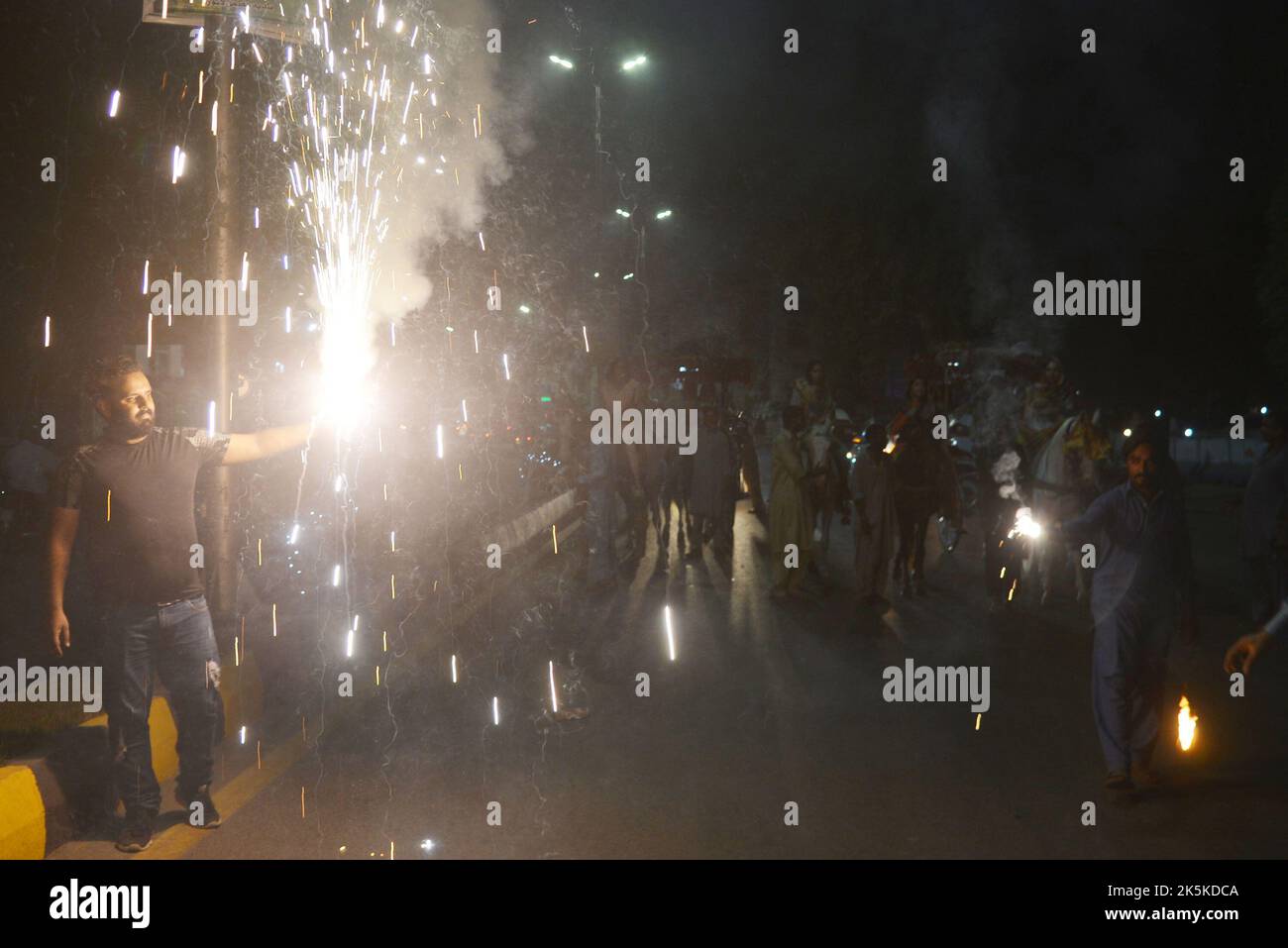 Lahore, Punjab, Pakistan. 8th Oct, 2022. Pakistani people light ...