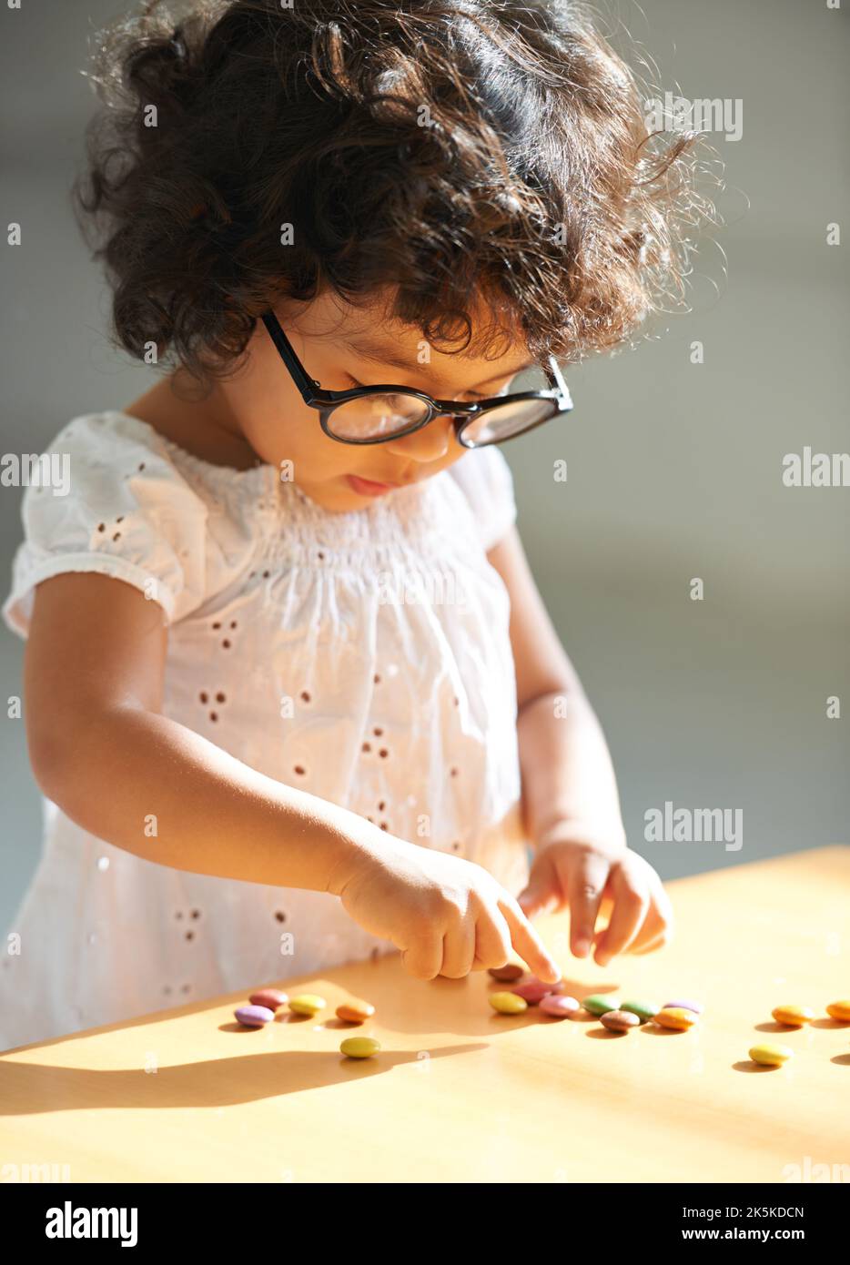 Child counting candy hi-res stock photography and images - Alamy