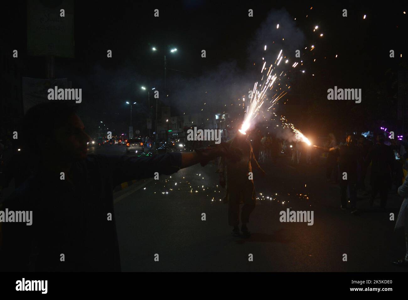 Lahore, Punjab, Pakistan. 8th Oct, 2022. Pakistani people light ...