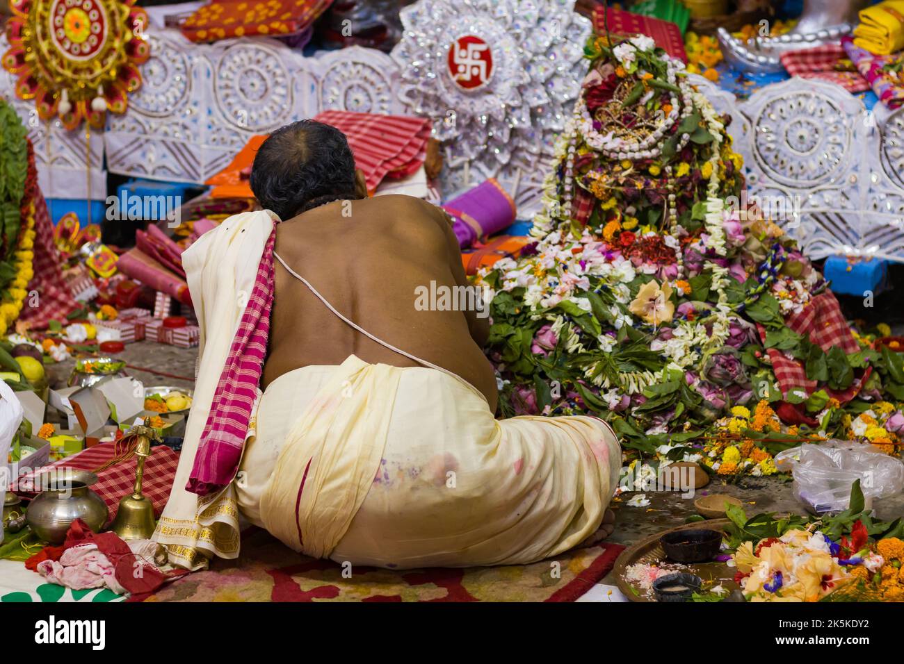 puja rituals being performed by hindu priest with flowers like china ...