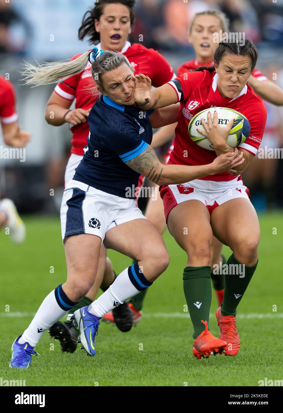 Wales Ffion Lewis holds off Scotland's Chloe Rollie during the Women's ...