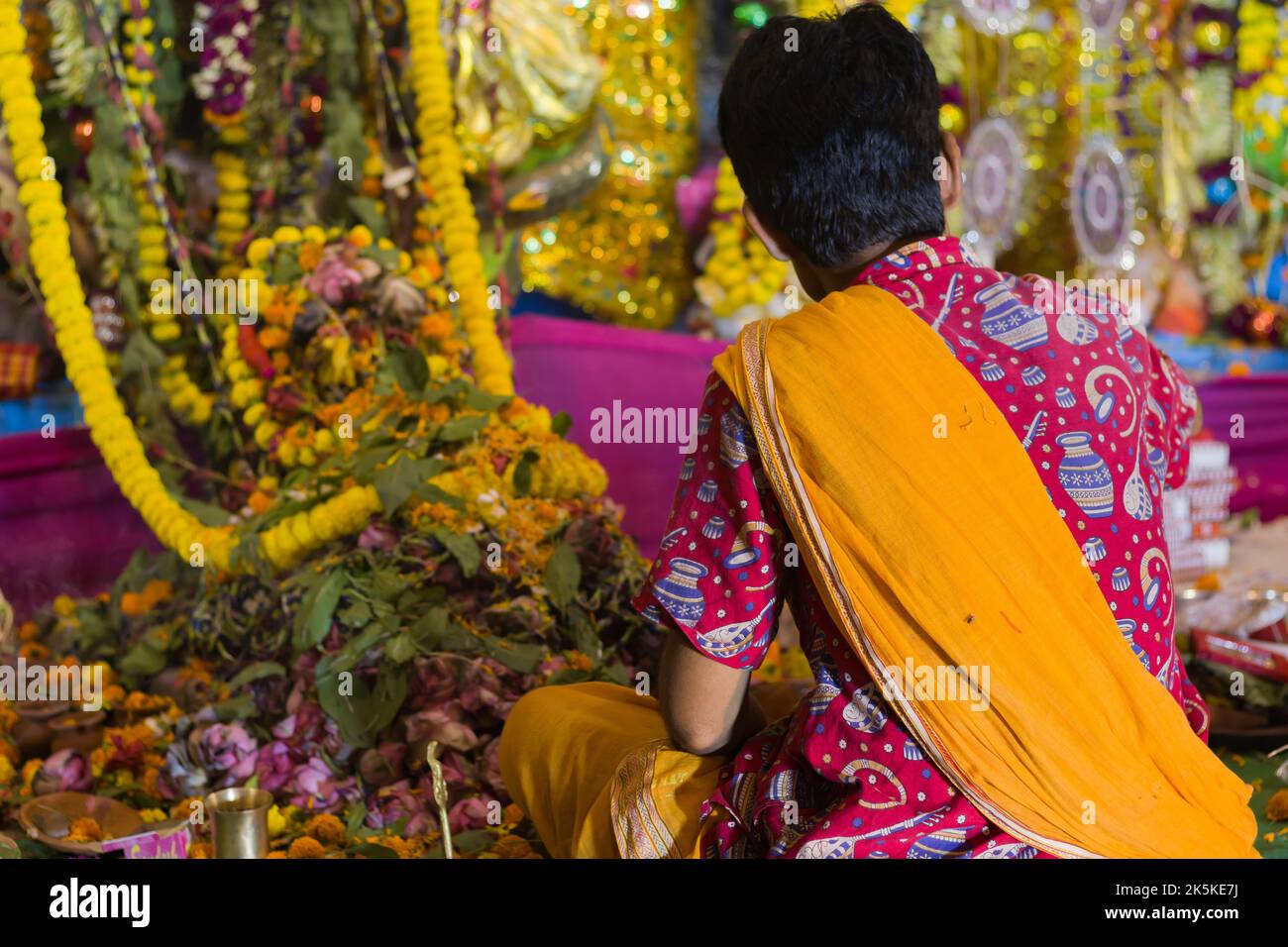 puja rituals being performed by hindu priest with flowers and other ...